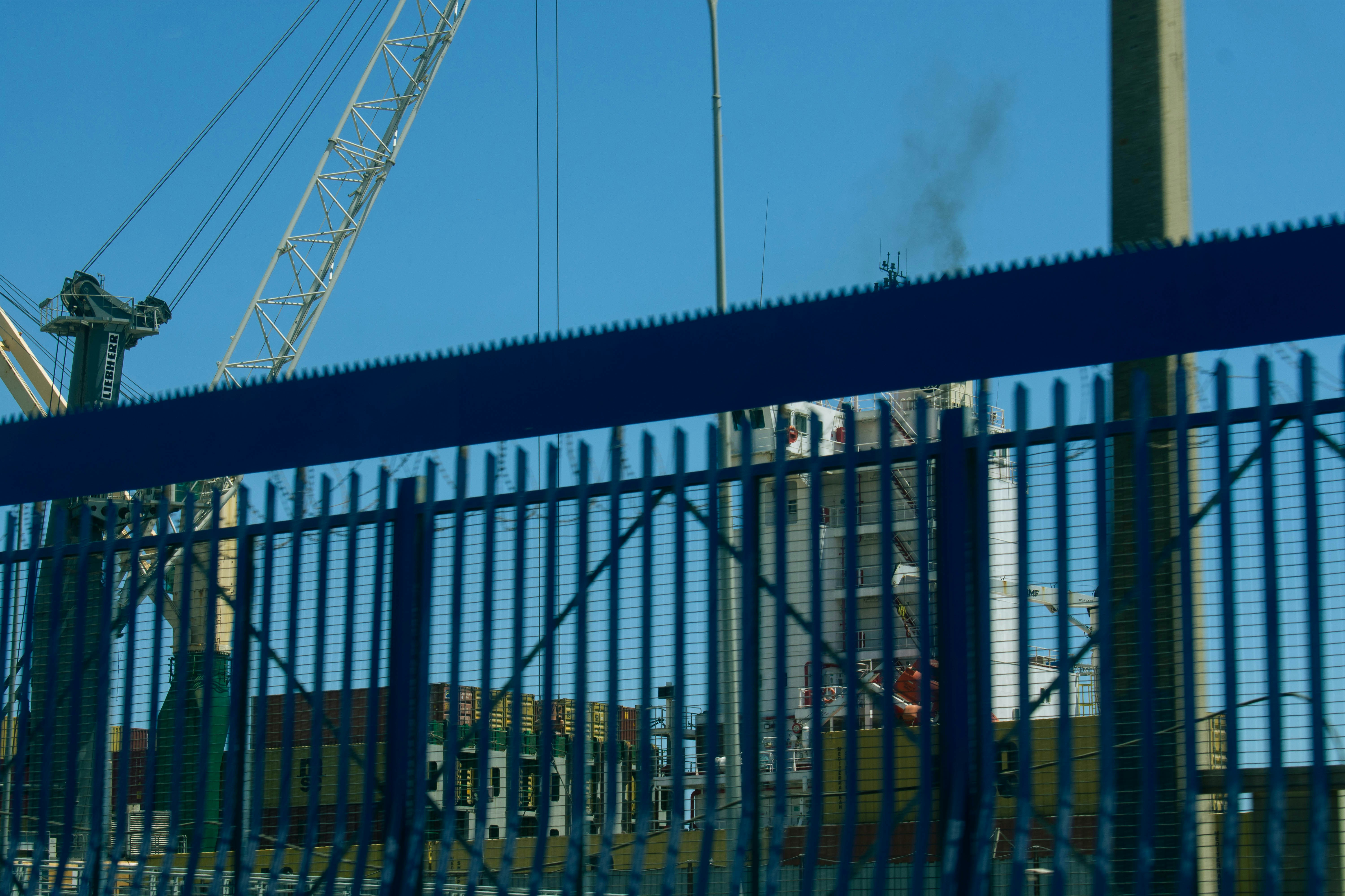 Locked Fence, Rising Construction: A glimpse into an industrial morning