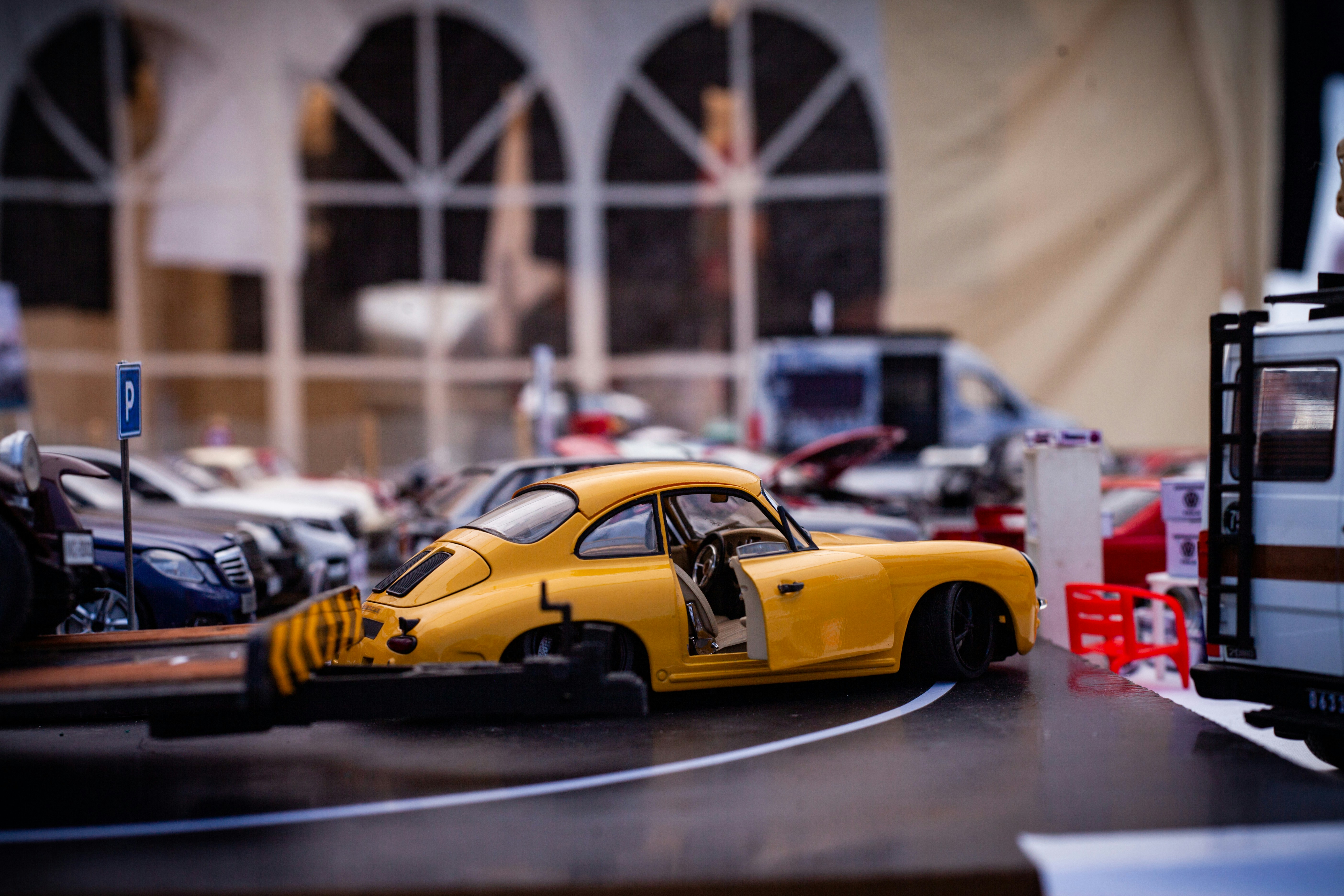 a yellow sports car in a garage