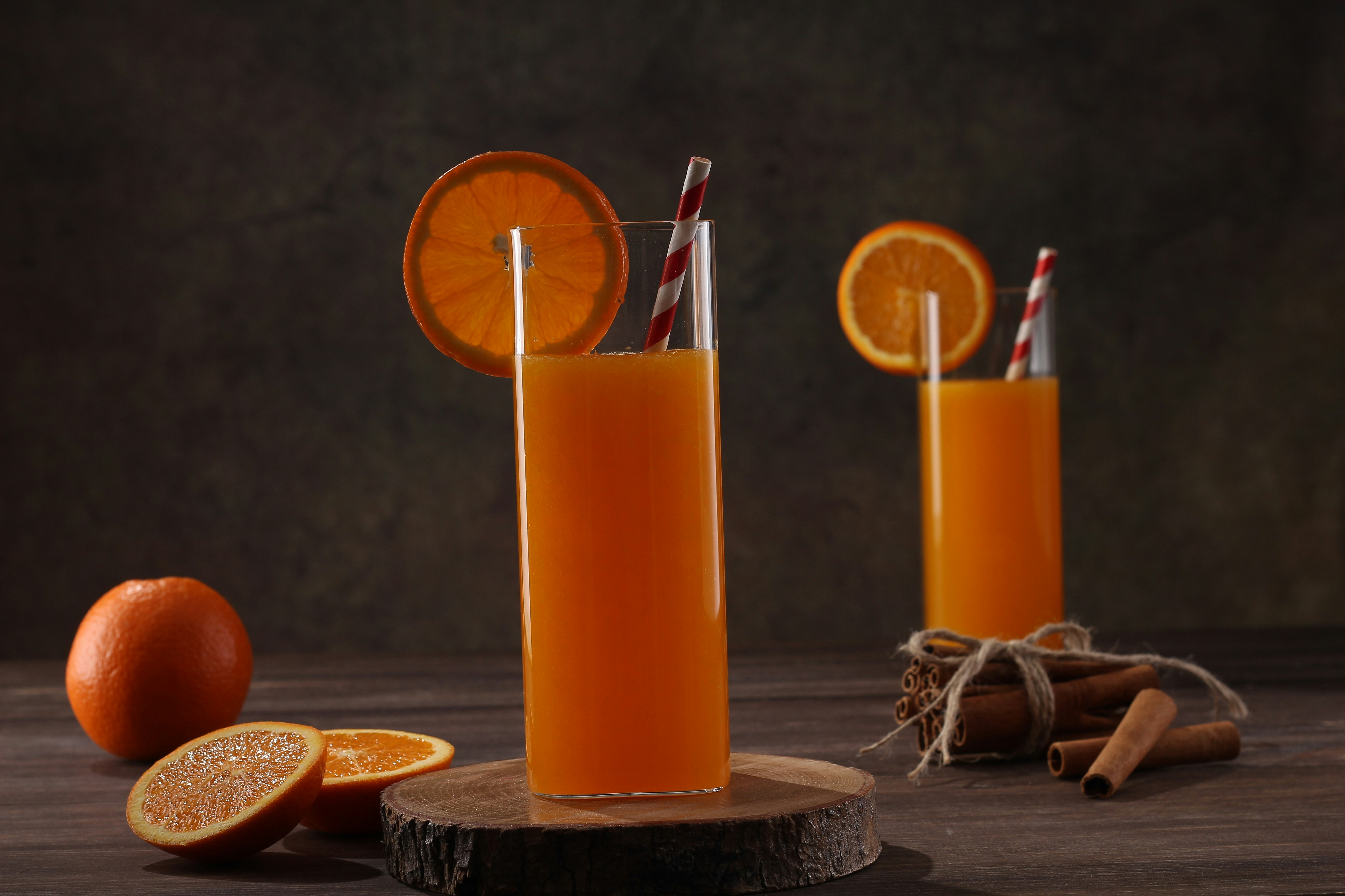 Citrus Still-Life: Two Orange Juices on Weathered Wood