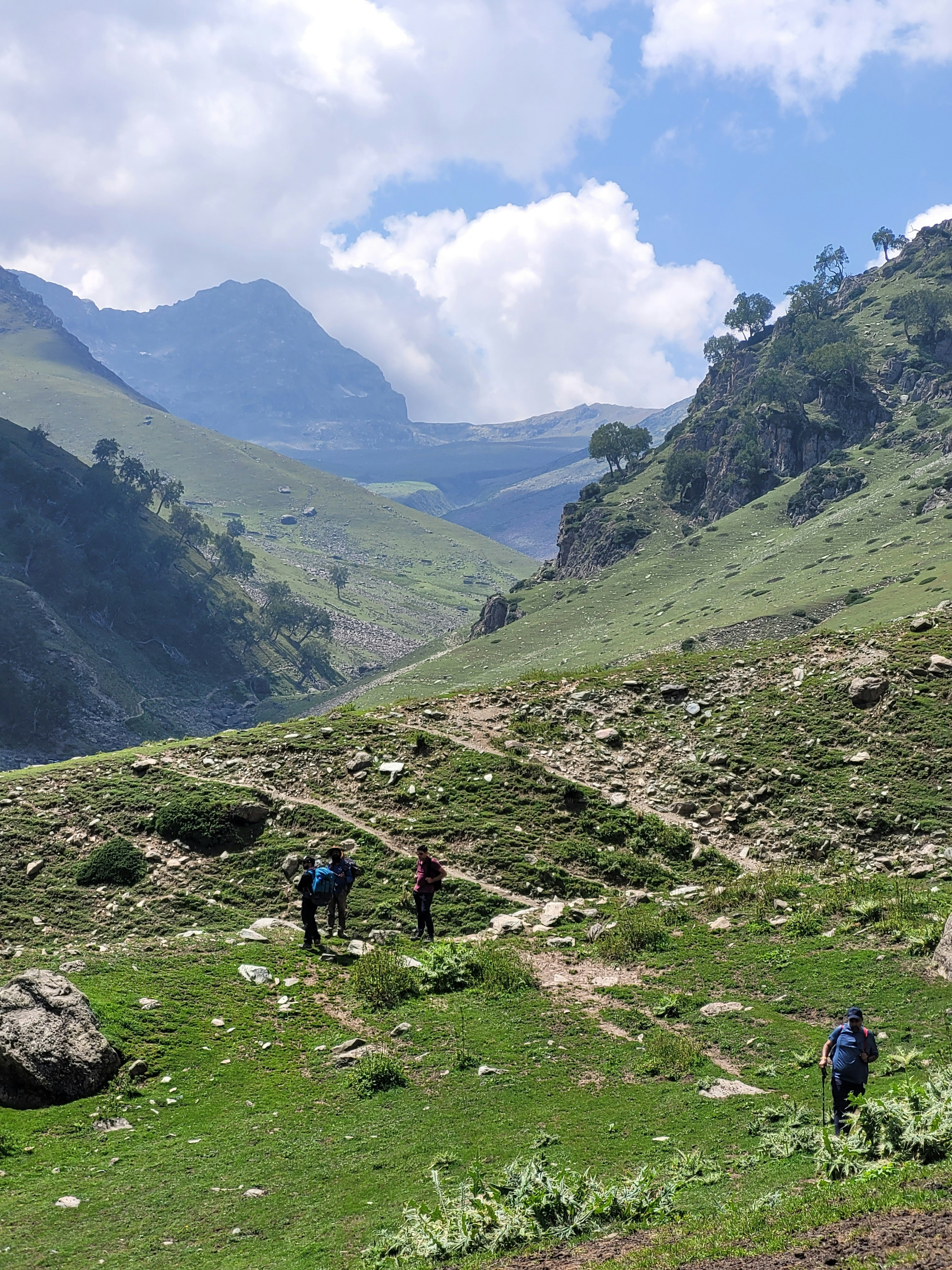 A group of people hiking in a valley photo – Free Mountain Image on ...