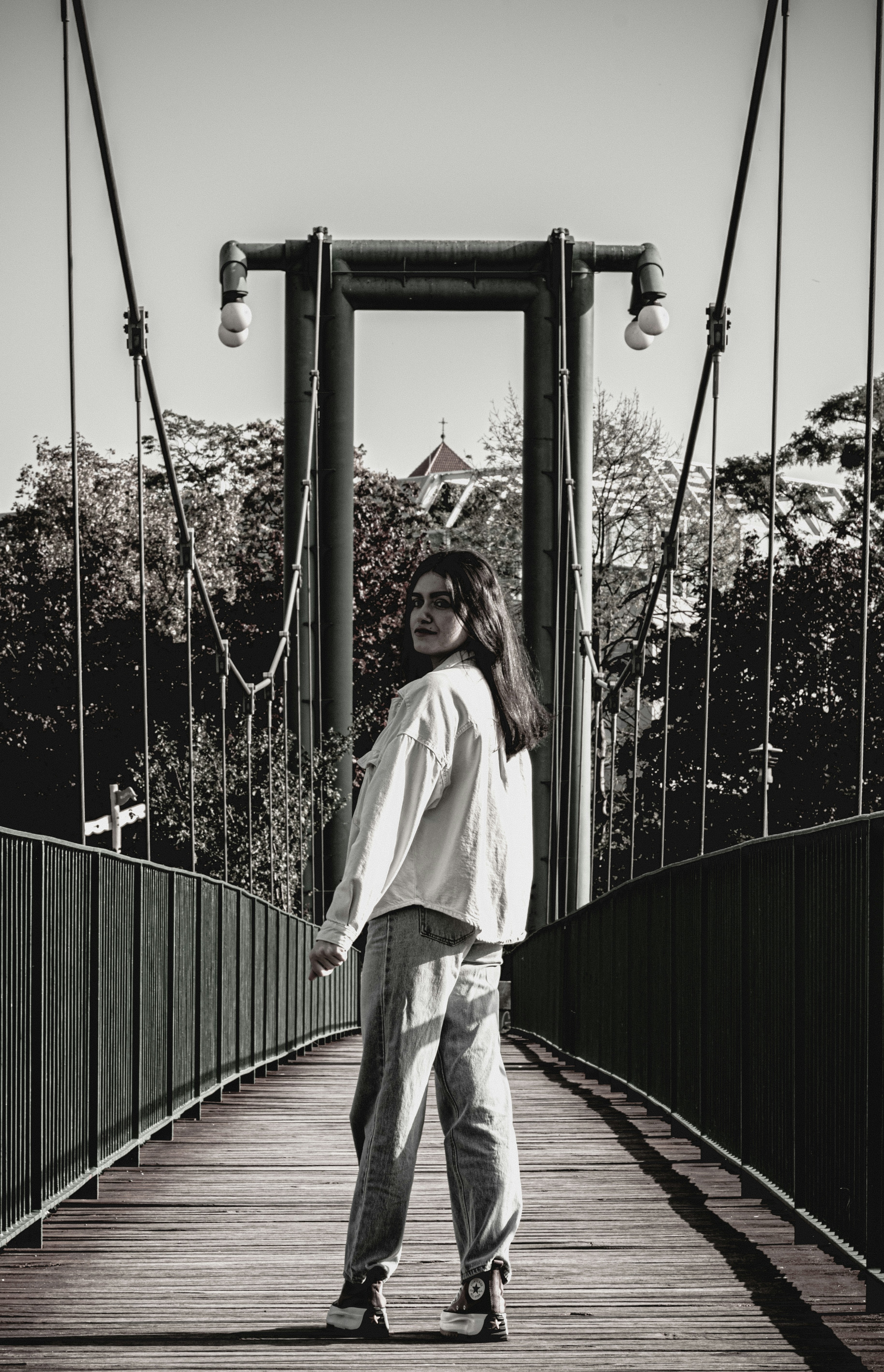 Gaze Along the Cables: A Quiet Portrait Beneath the Suspension Bridge