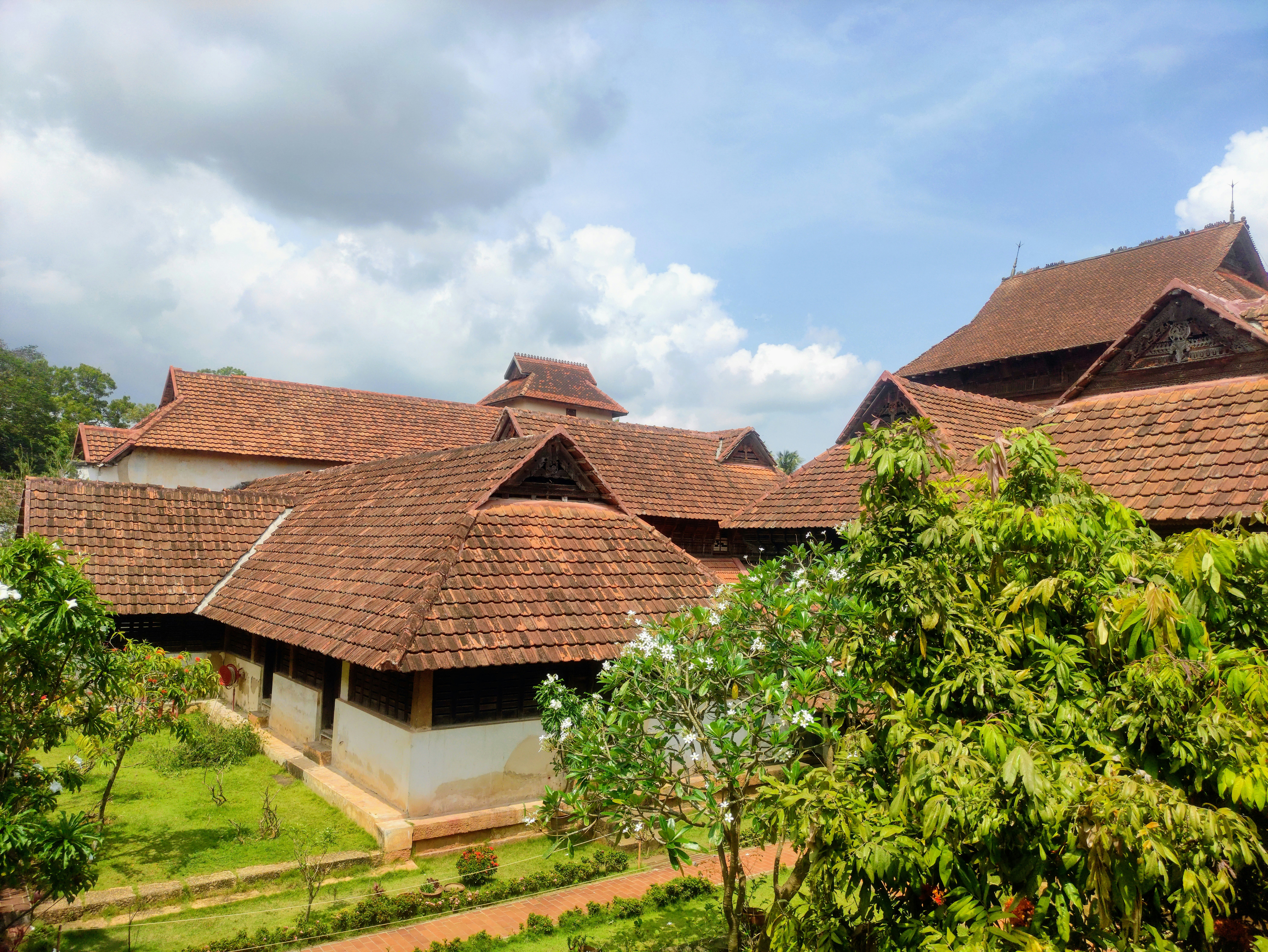 Sunlit Terracotta Roofscape: A Traditional Compound in Bloom