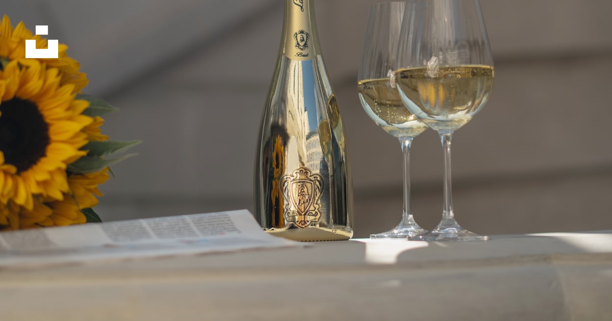 A Bottle Of Wine And A Glass Of Wine On A Table Photo Free Wine Image On Unsplash