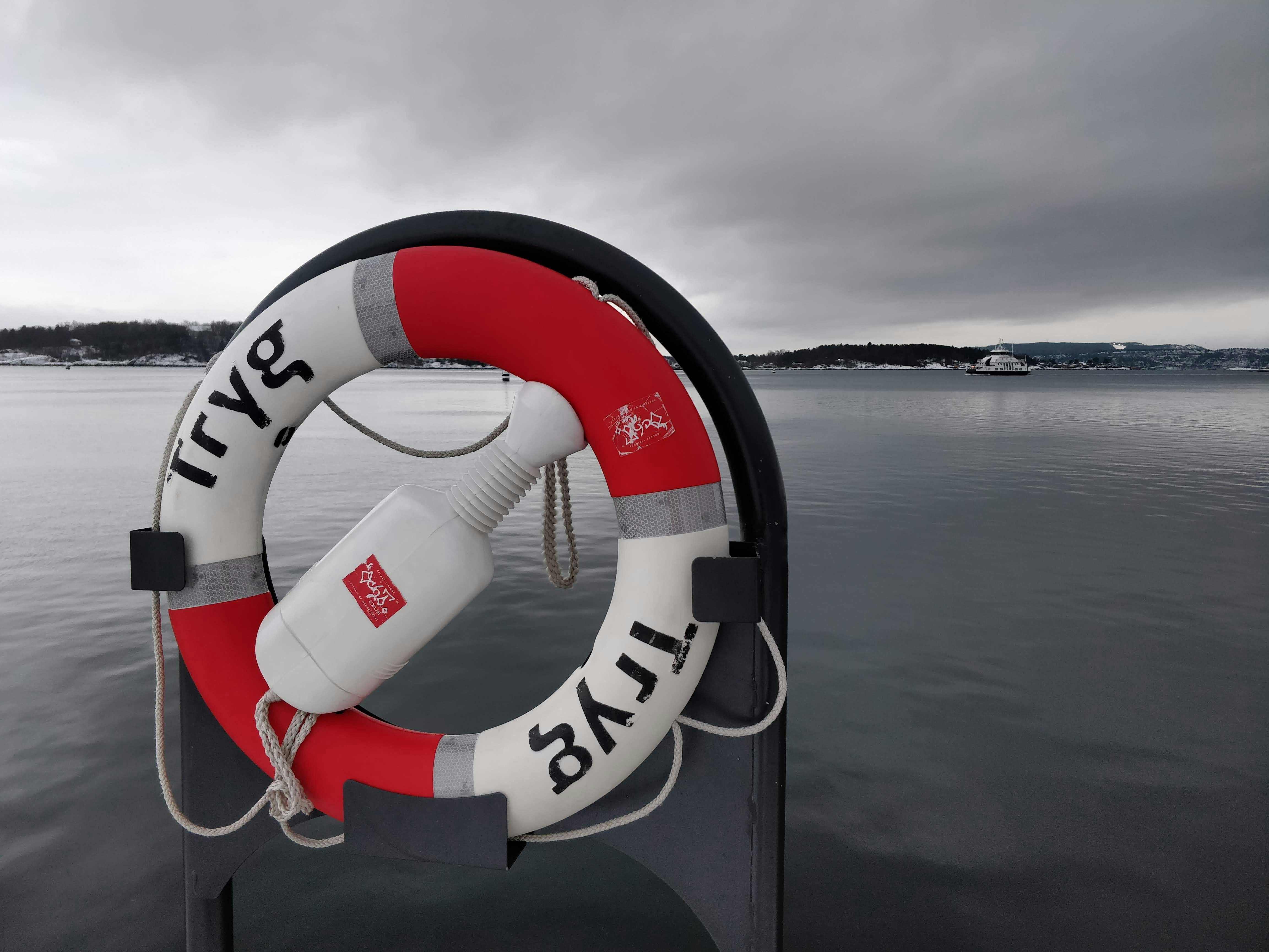 A life preserver on a body of water photo – Free Norway Image on Unsplash