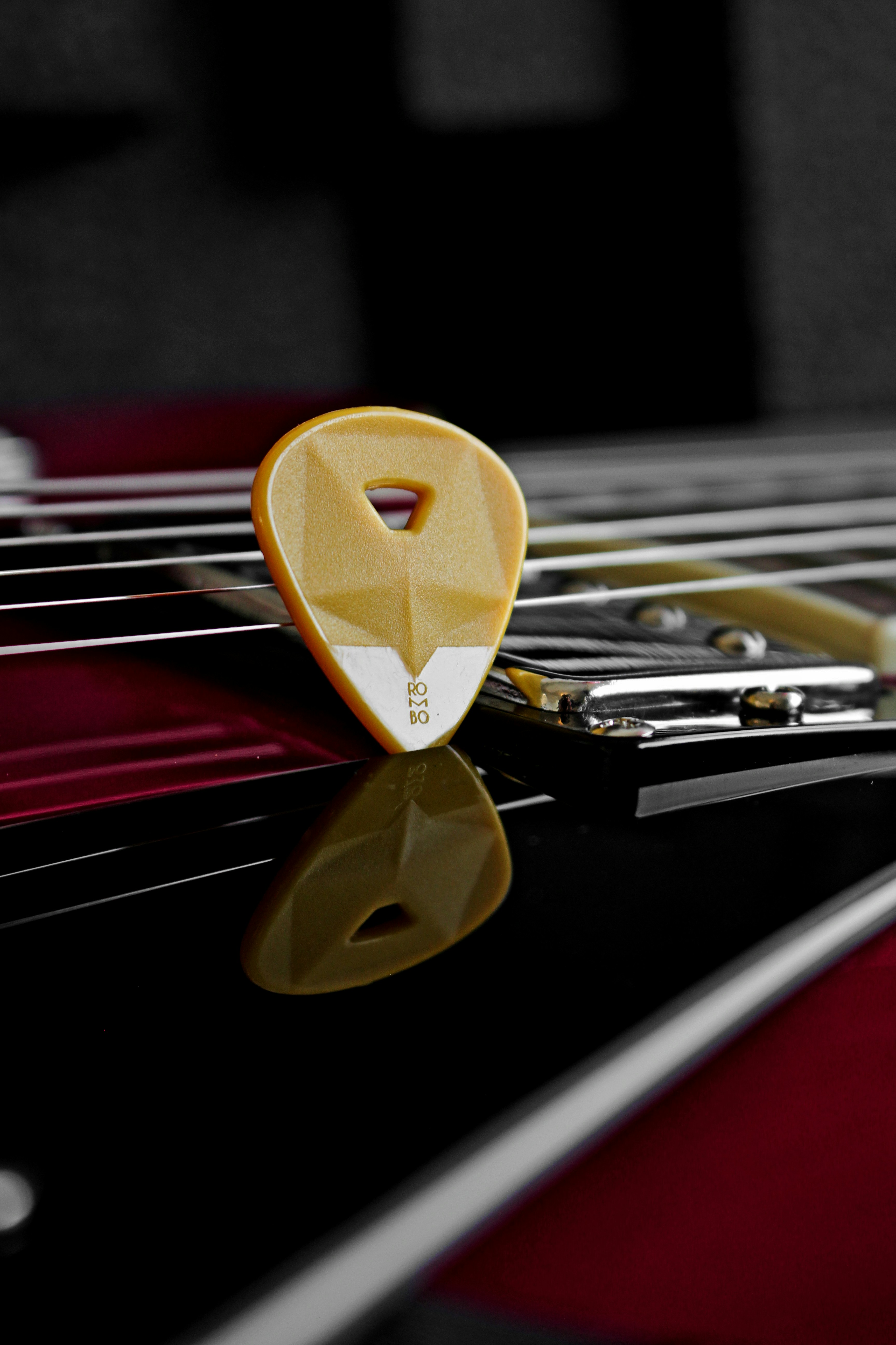 A close-up of a guitar photo – Free Plectrum Image on Unsplash