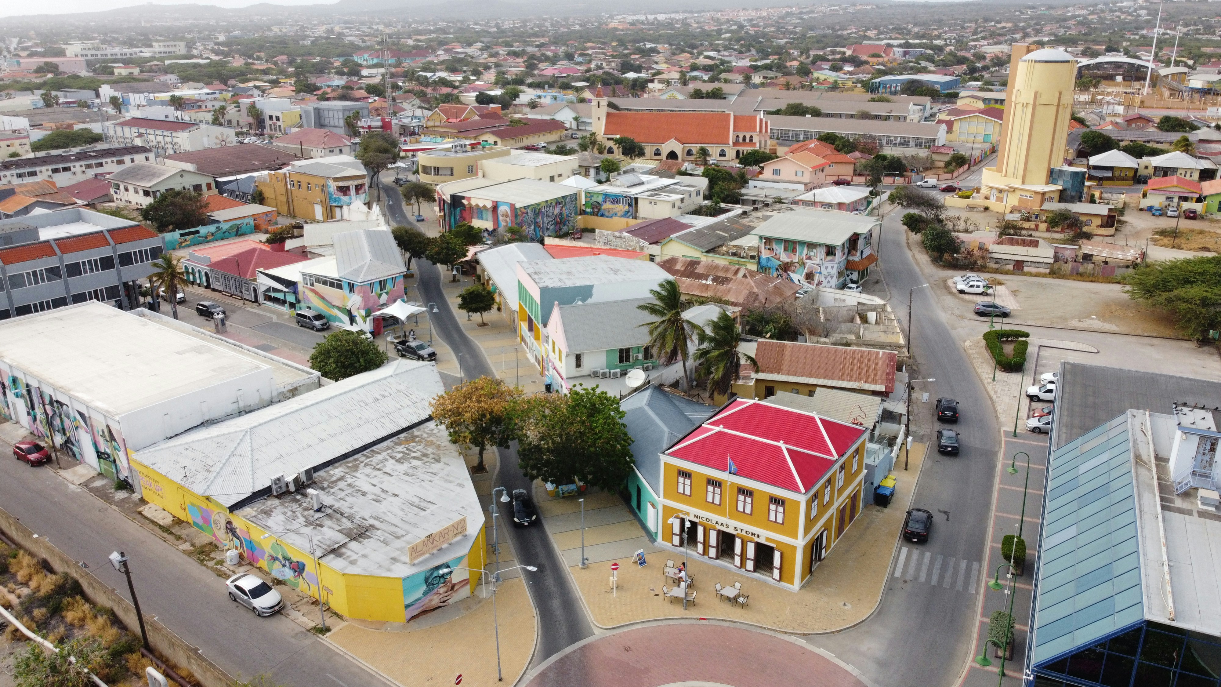 Aerial view of San Nicolas showcasing colorful buildings and winding streets.