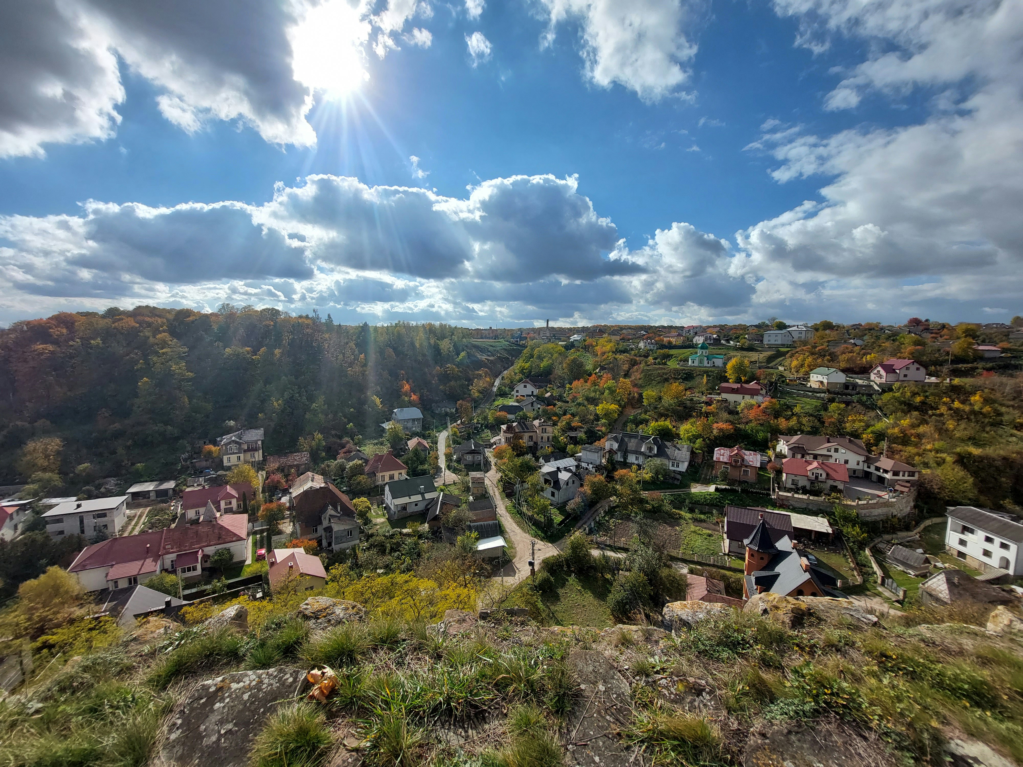 a town with trees and hills