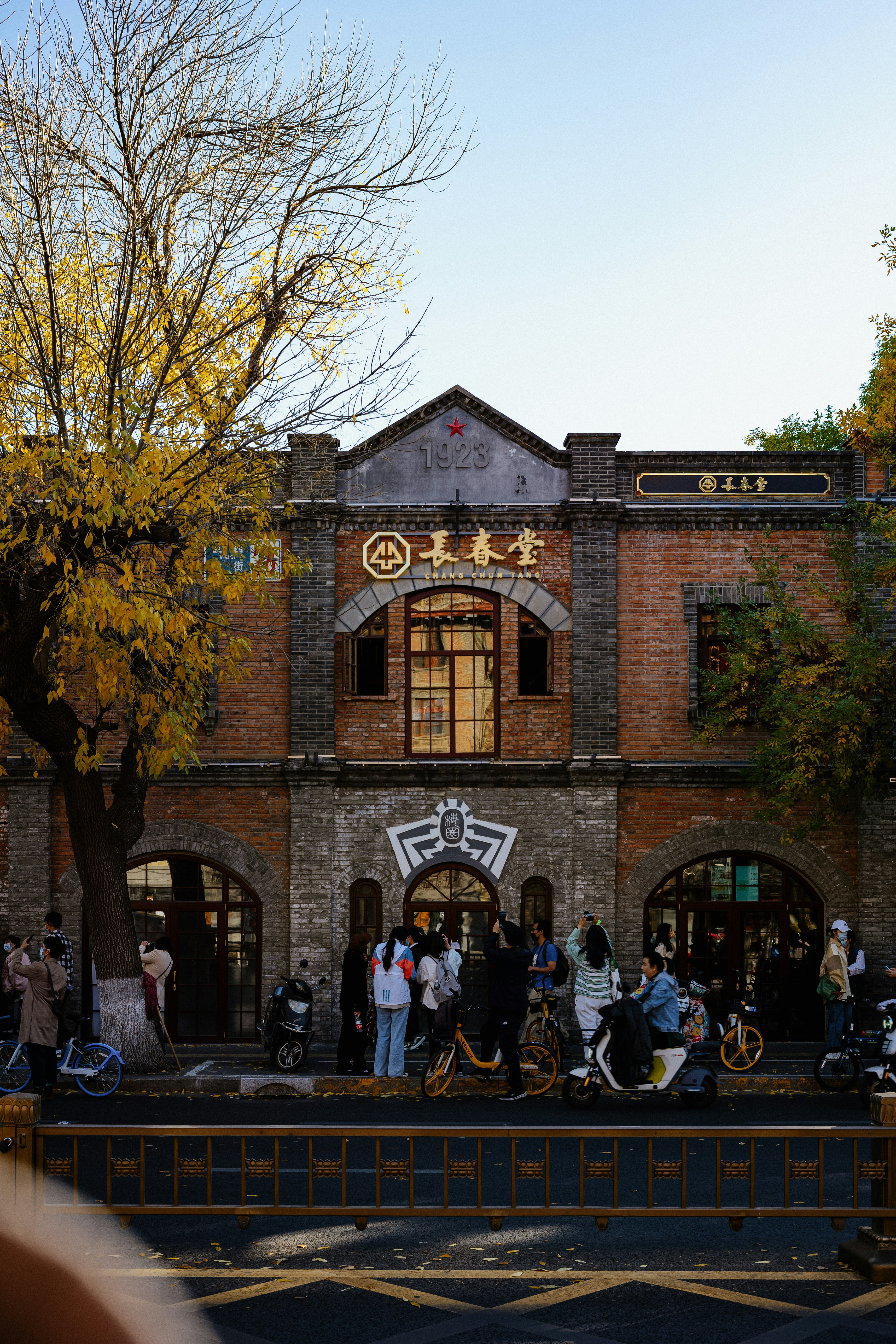 A group of people standing outside a building photo – Free Image on ...