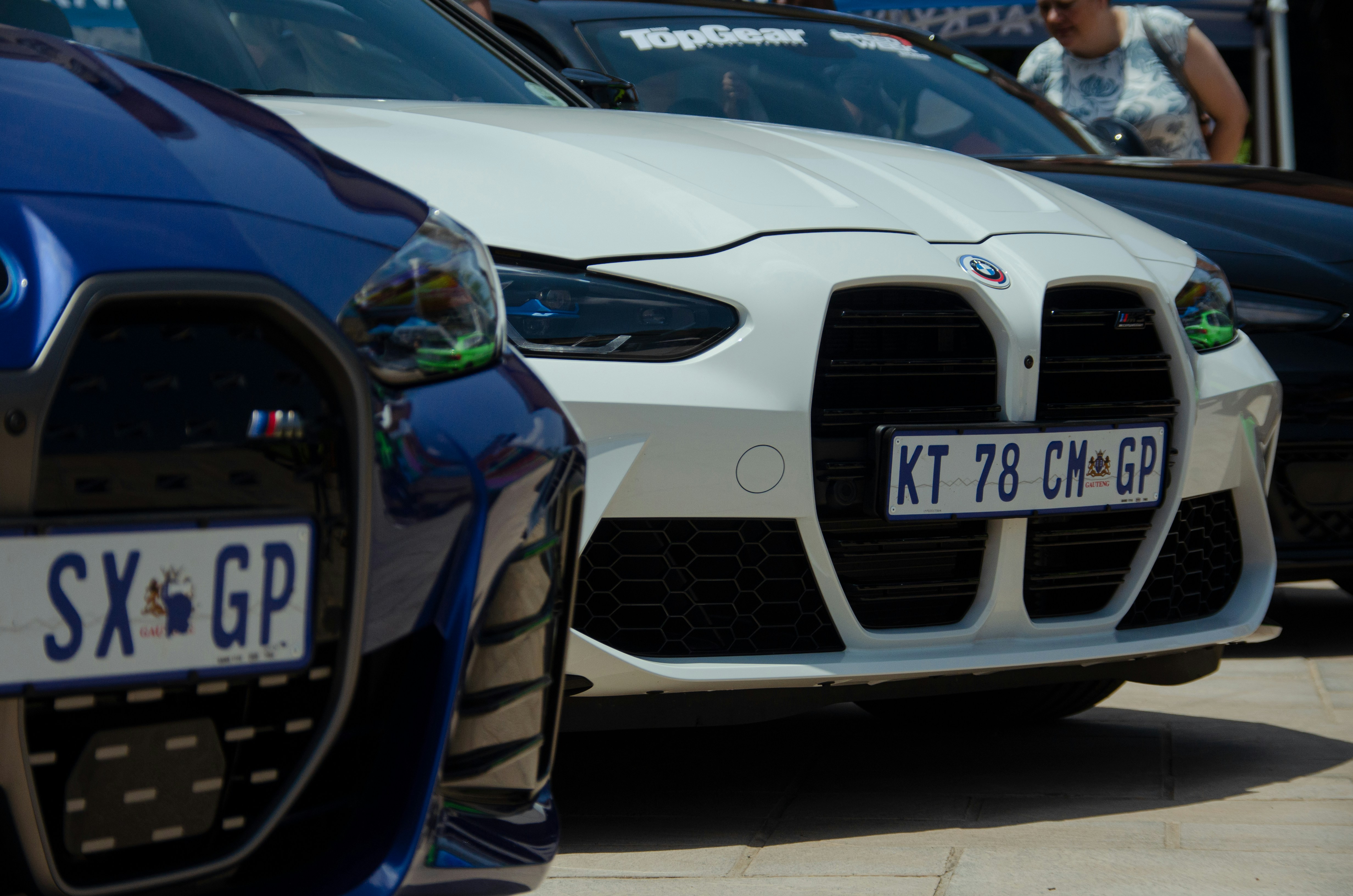 A couple of cars parked next to each other photo – Free Bmw m4 Image on ...