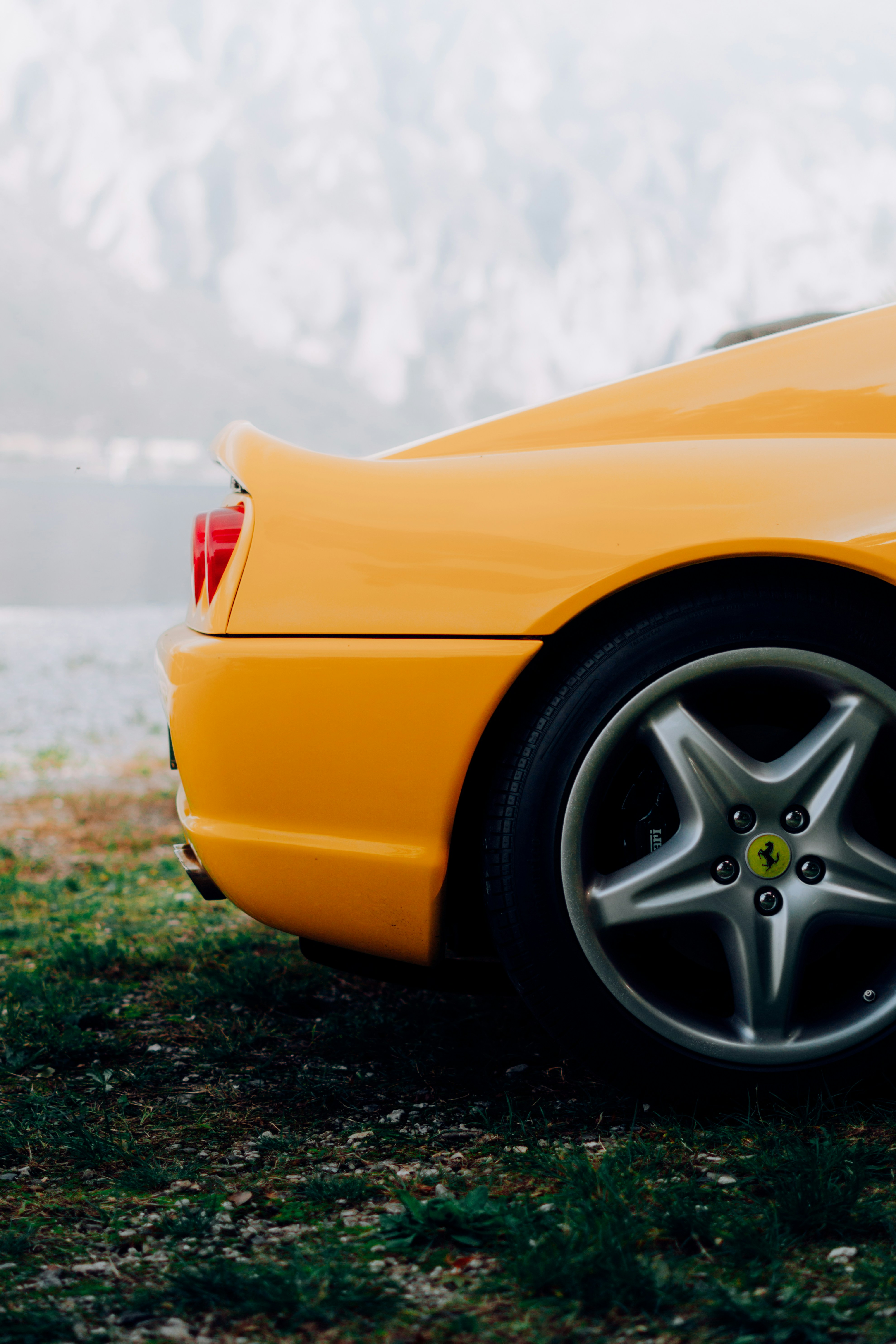 Amber Curves: Rear Quarter of a Yellow Ferrari in Focus