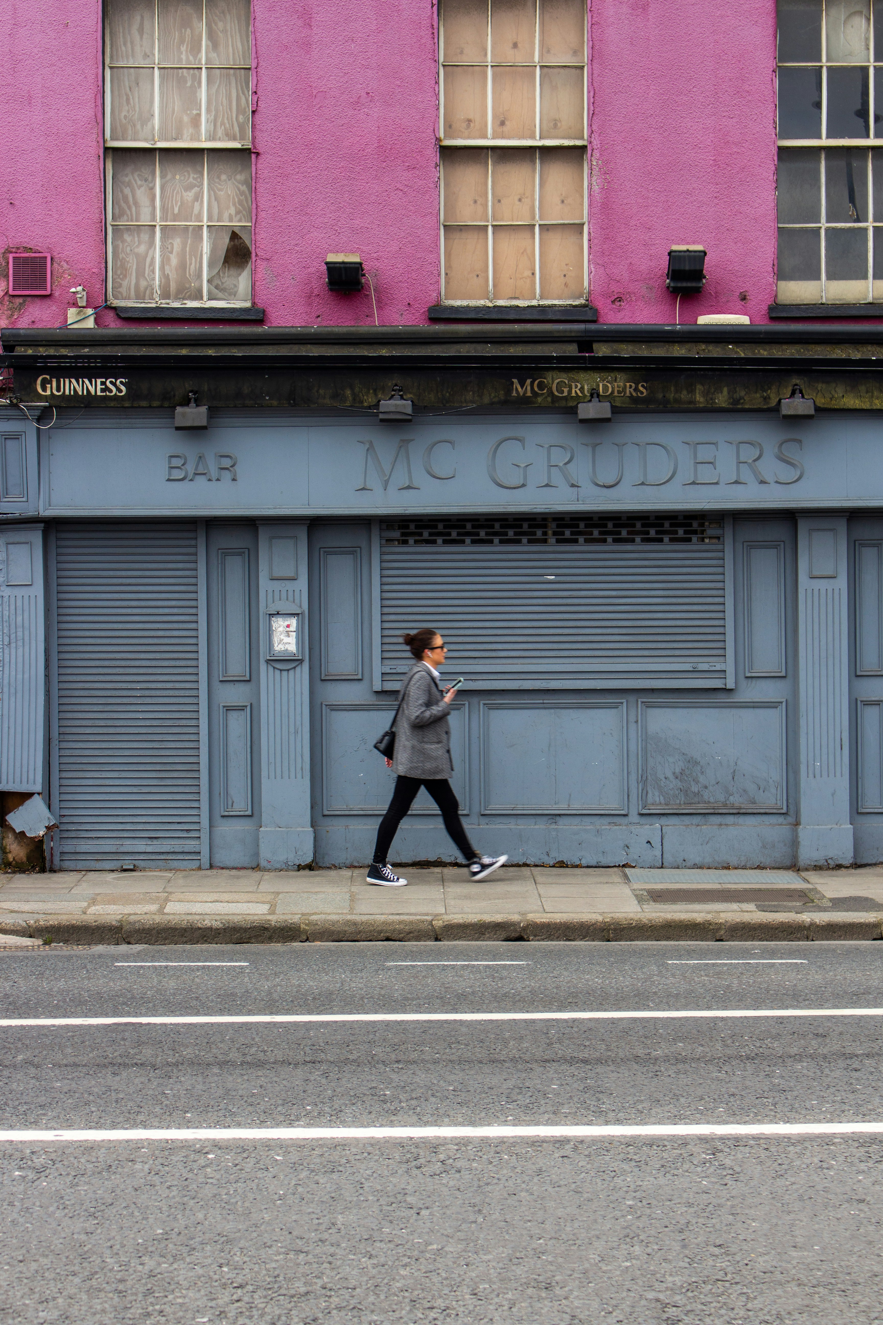 a person walking on the sidewalk
