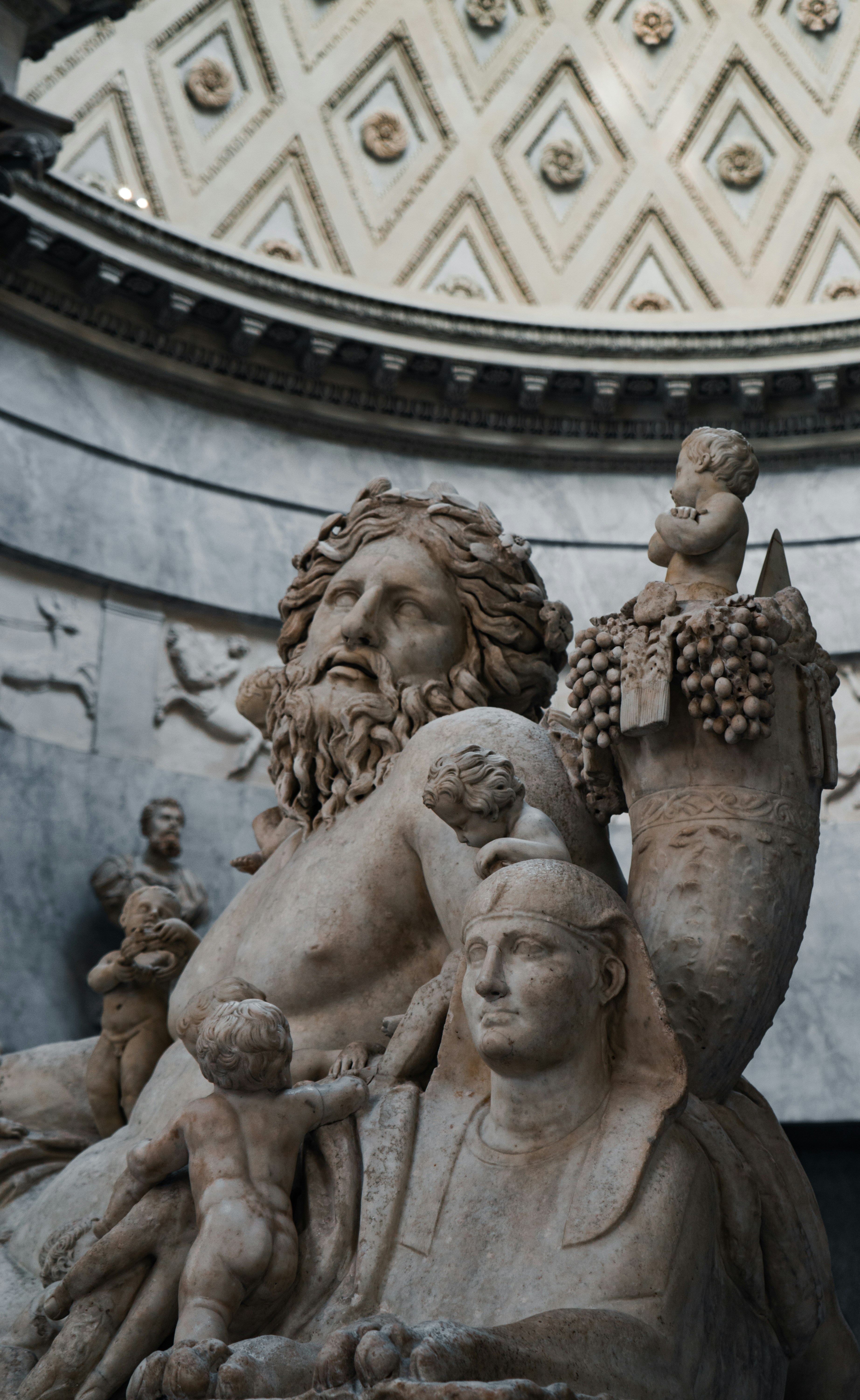 A statue of a person with a group of babies photo – Free Building Image ...