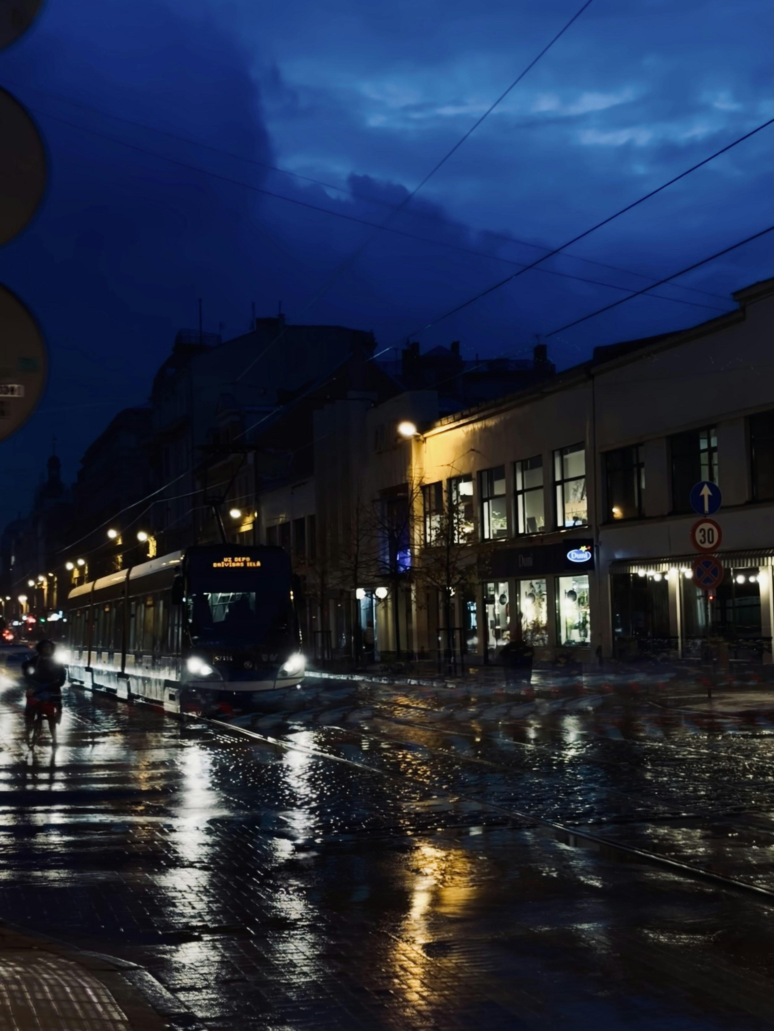 A trolley on a street at night photo – Free Town Image on Unsplash