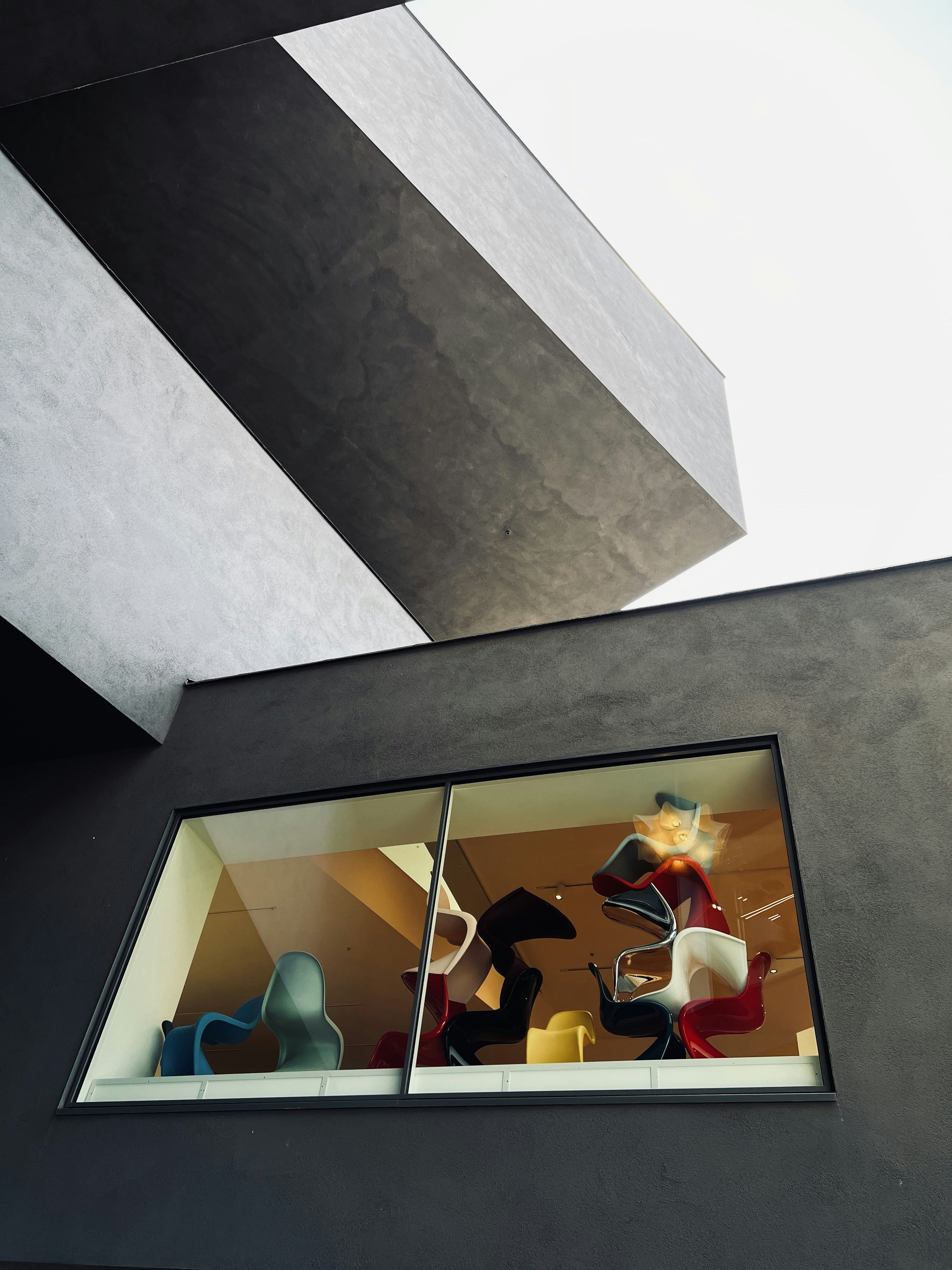 Window of Color Against Concrete Angles