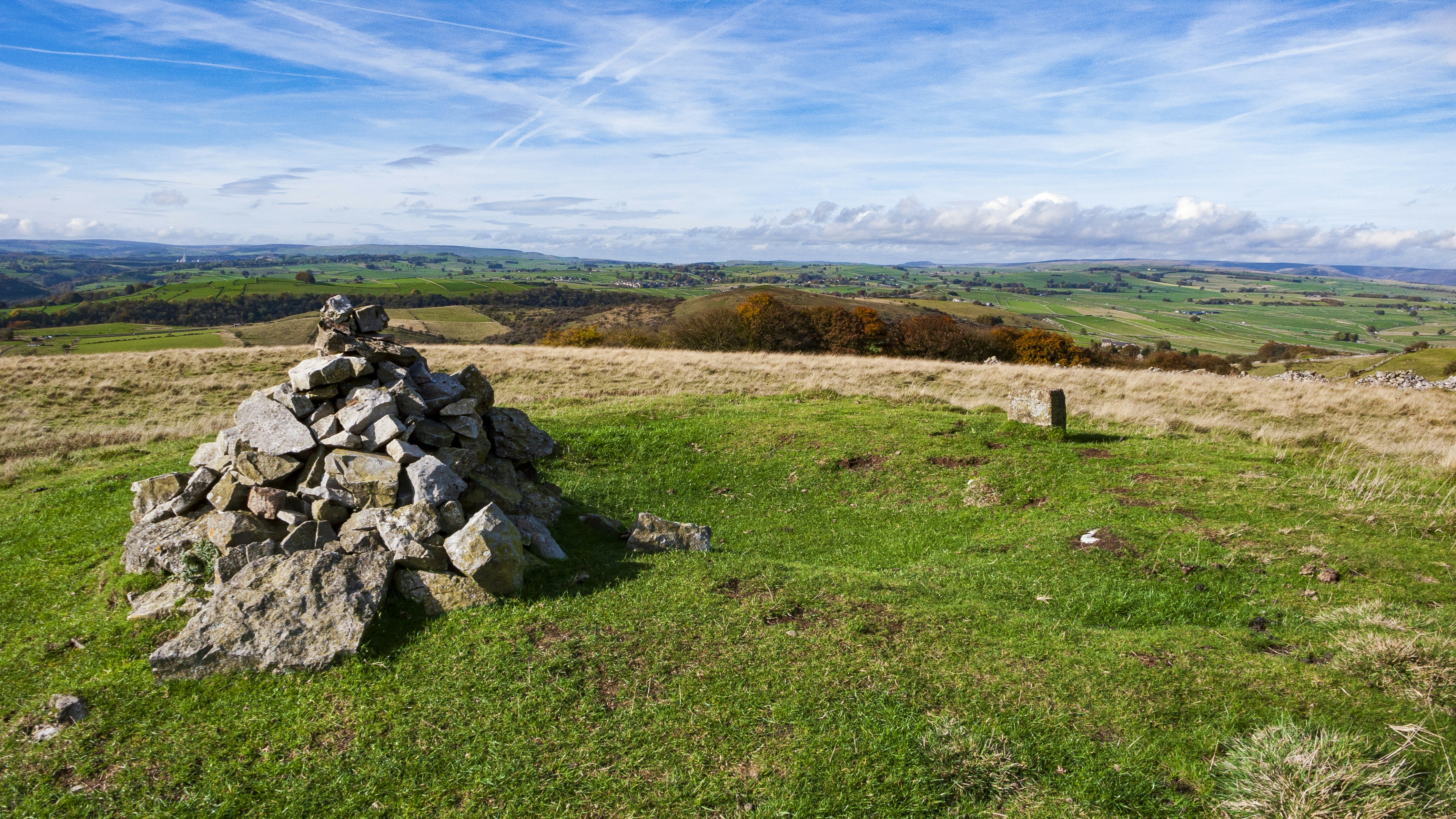 A pile of rocks in a field photo – Free Longstone moor Image on Unsplash