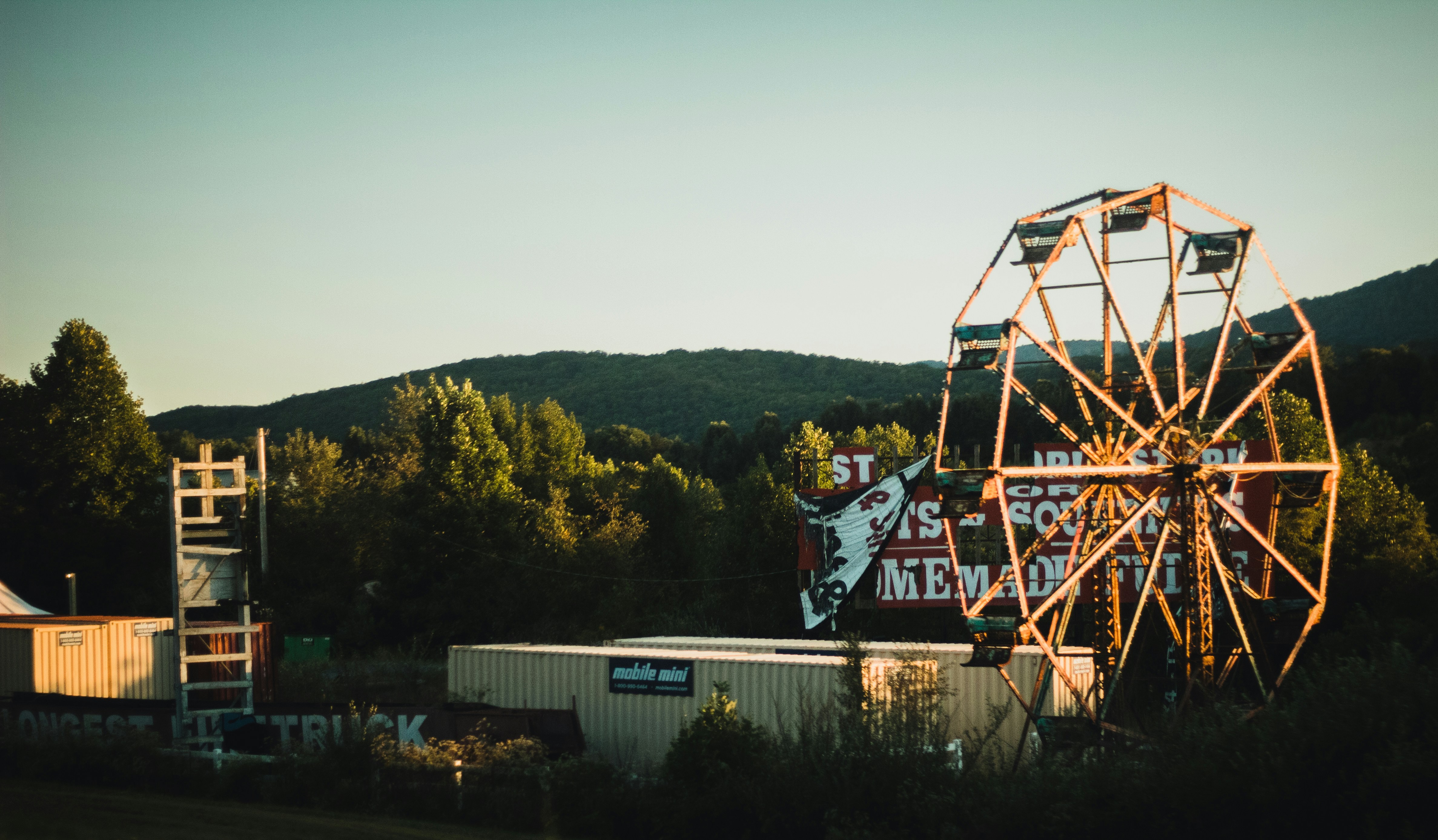Amber Ferris Wheel at the Edge of a Quiet Fairground