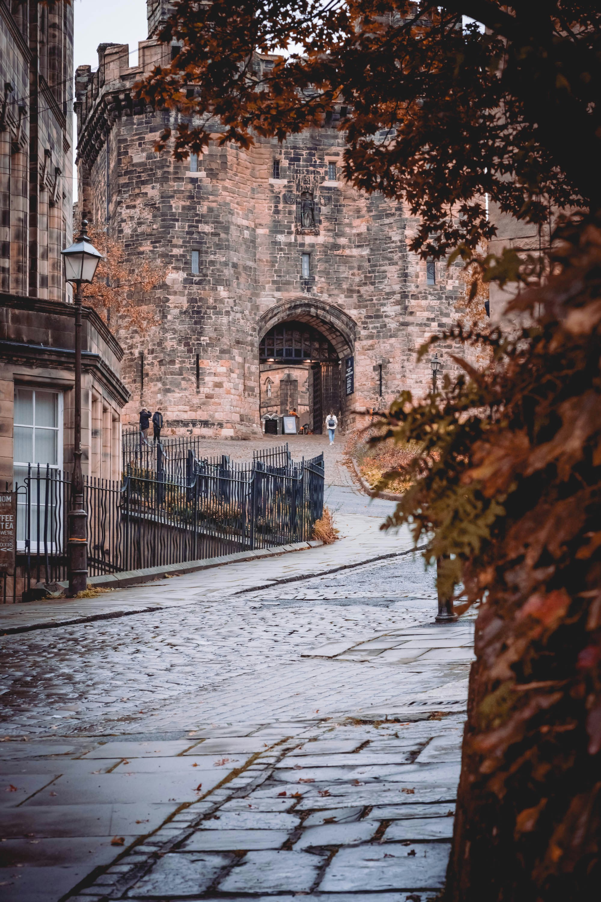Gateway to the City: A Cobblestone Path Framed by Ancient Walls