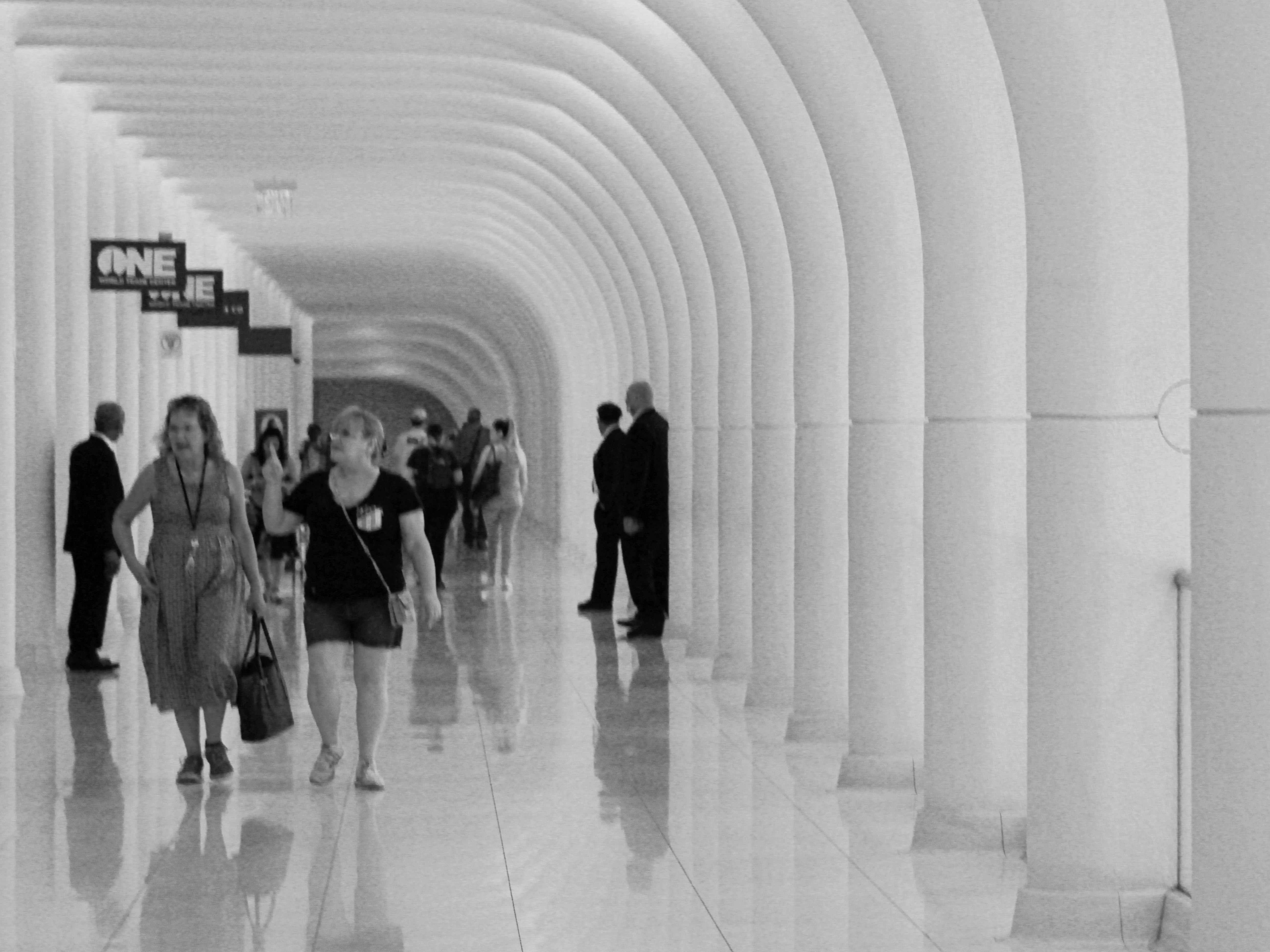 A group of people walking in a large building photo – Free Walking ...