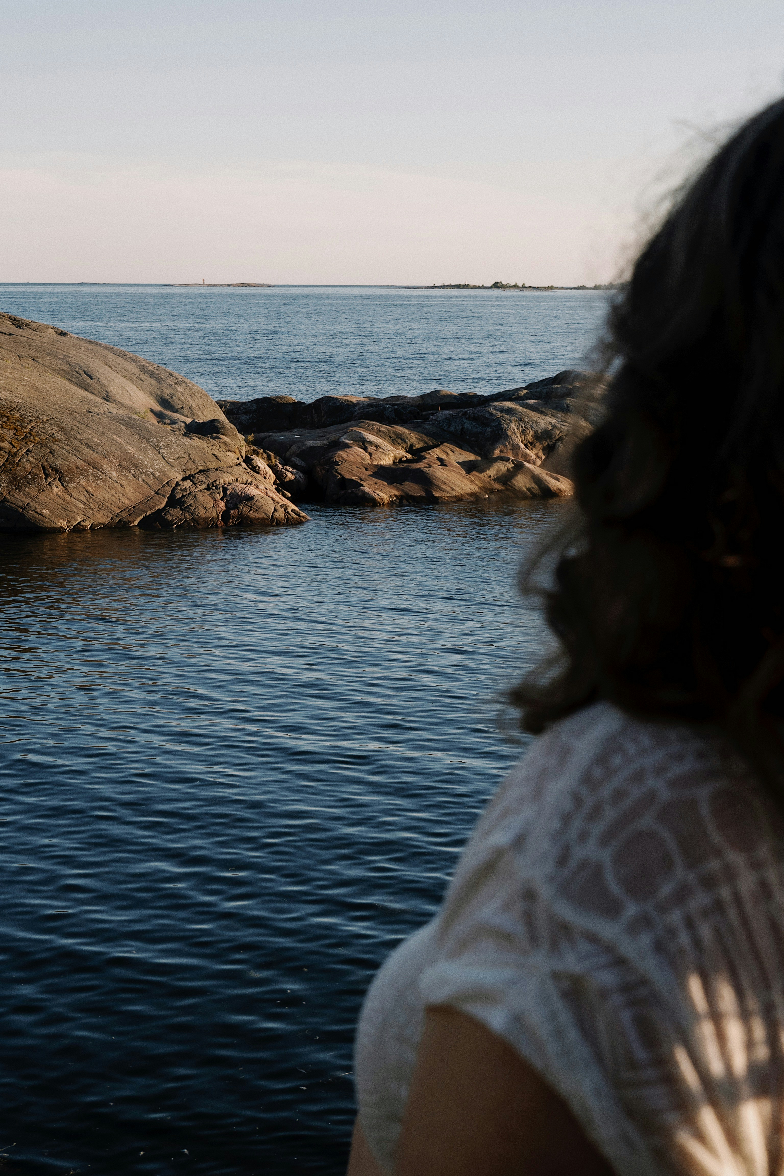A person looking out over the water photo – Free Helsinki Image on Unsplash