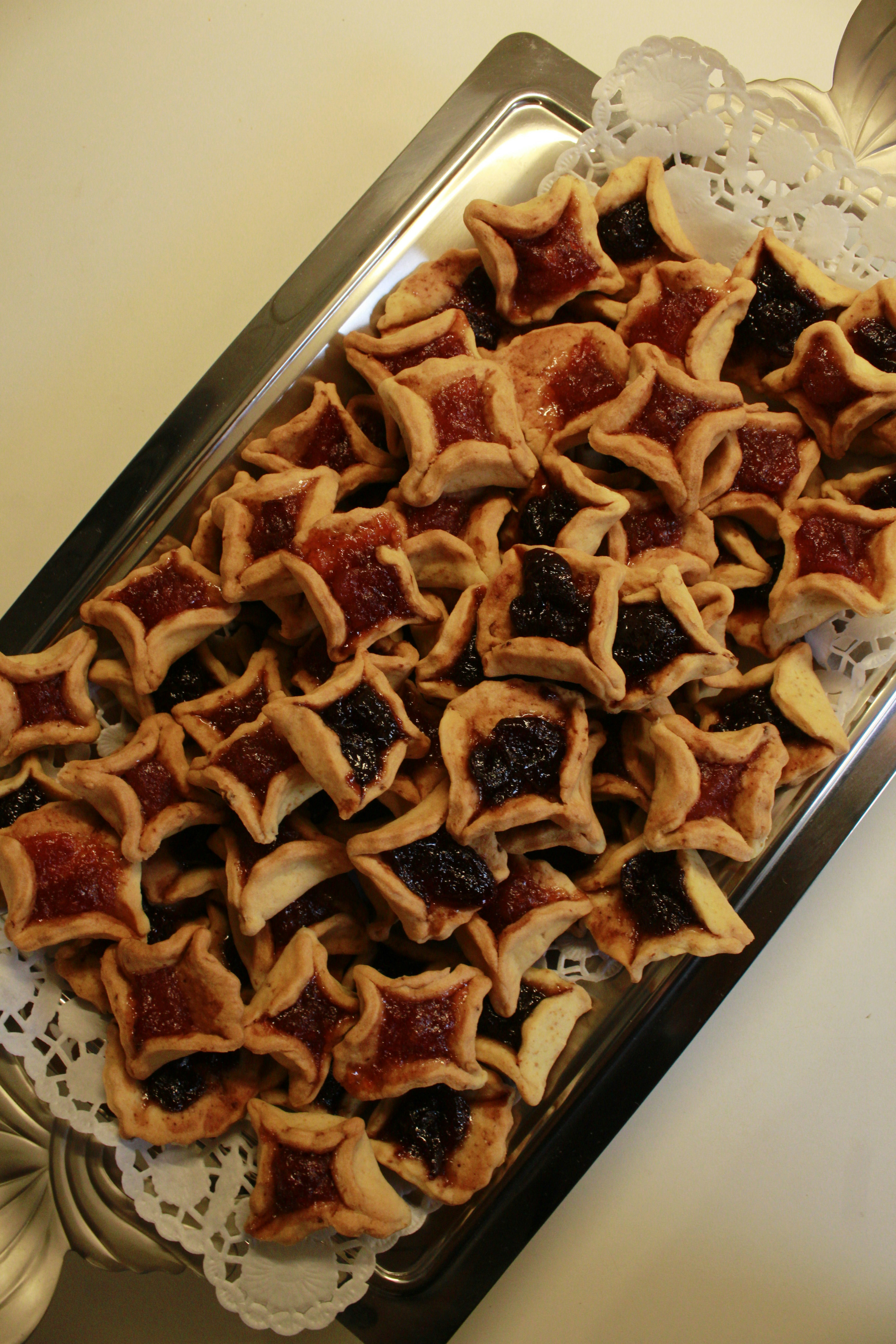 Strewn Star-shaped Linzer Cookies on a Silver Tray