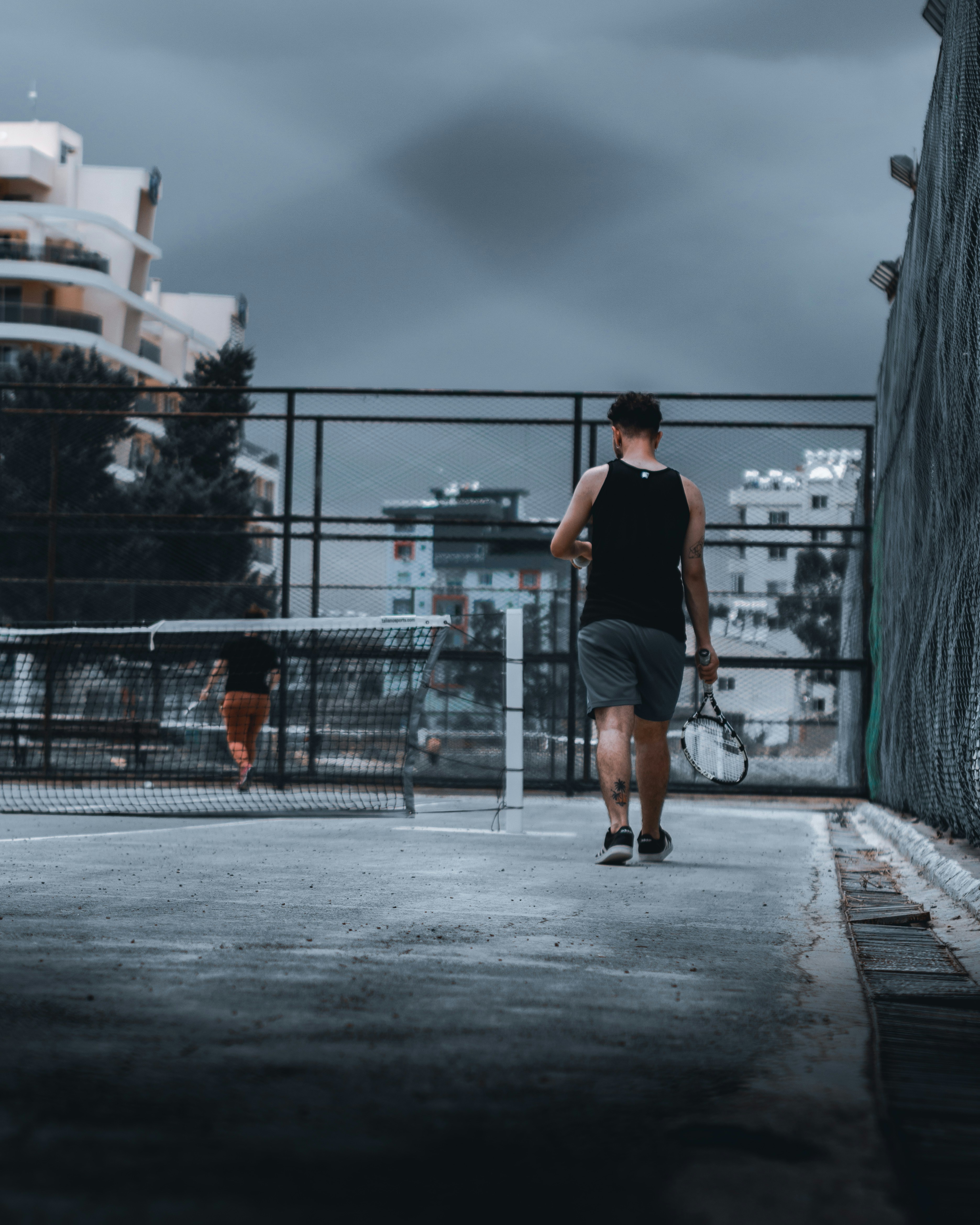 Runner at the Court’s Edge: Stormy City Backdrop