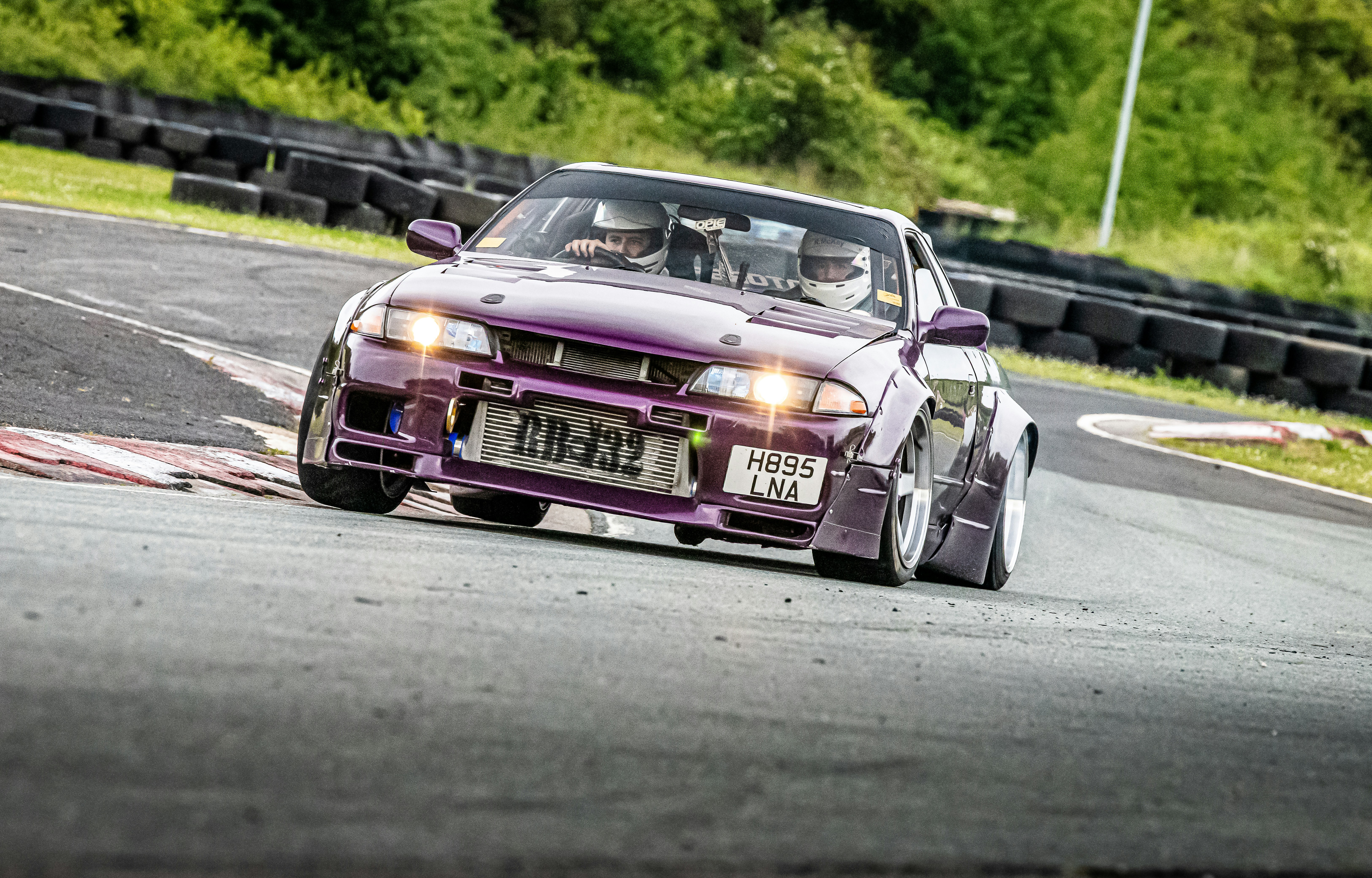 A purple race car on a road photo – Free Uk Image on Unsplash