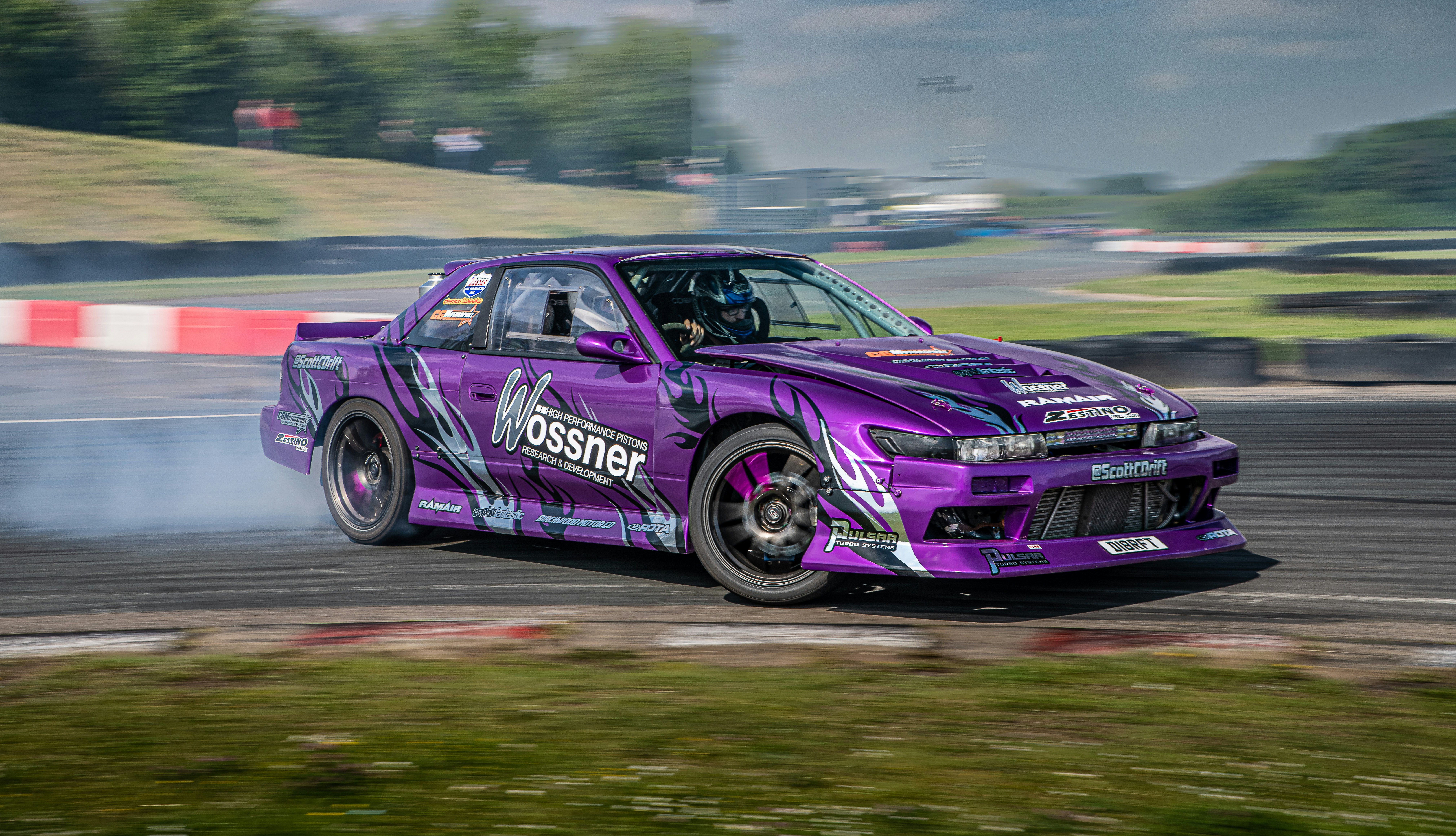 A purple race car on a track photo – Free Middlesbrough Image on Unsplash