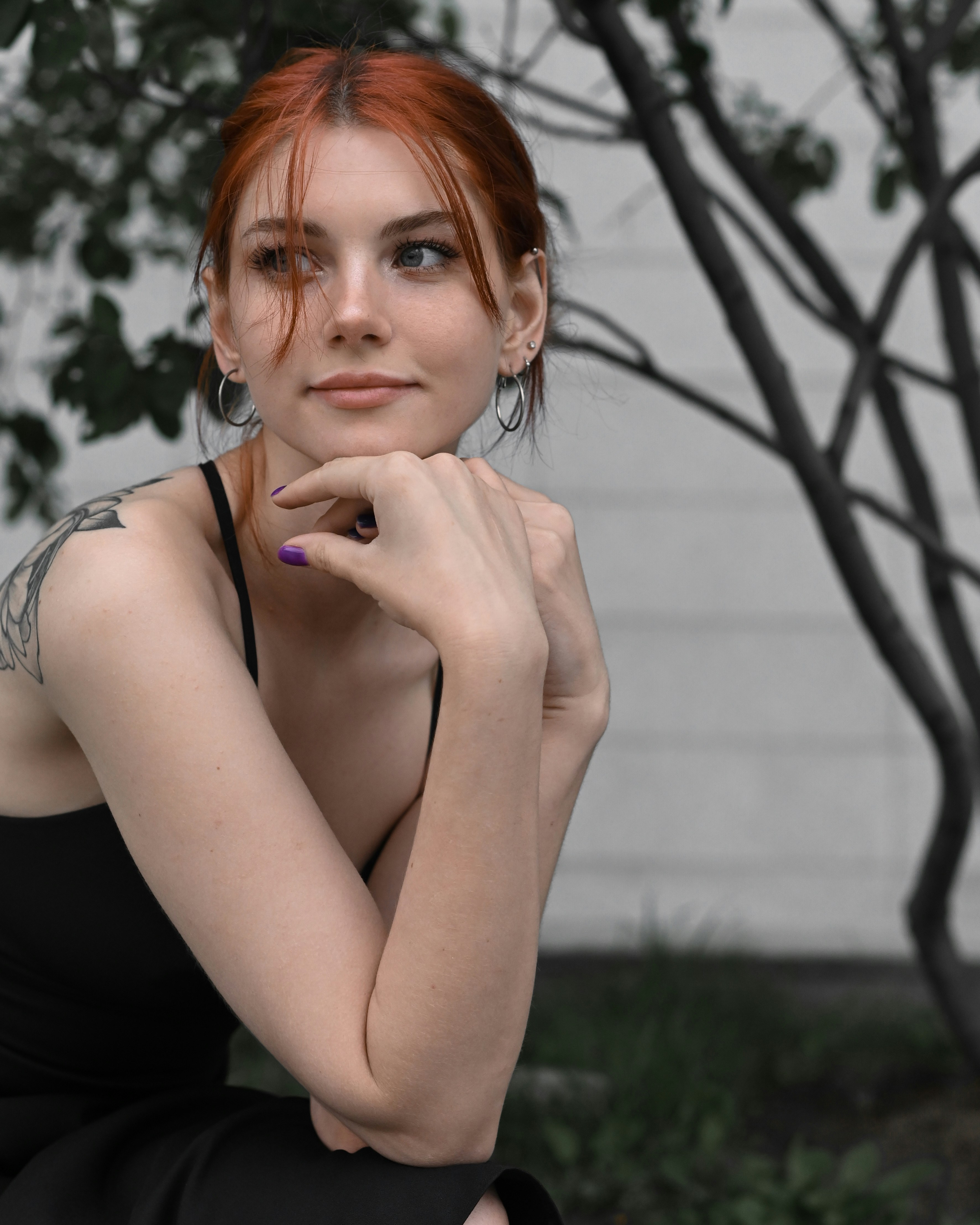 Crimson Gaze: A Quiet Portrait Beneath Branches