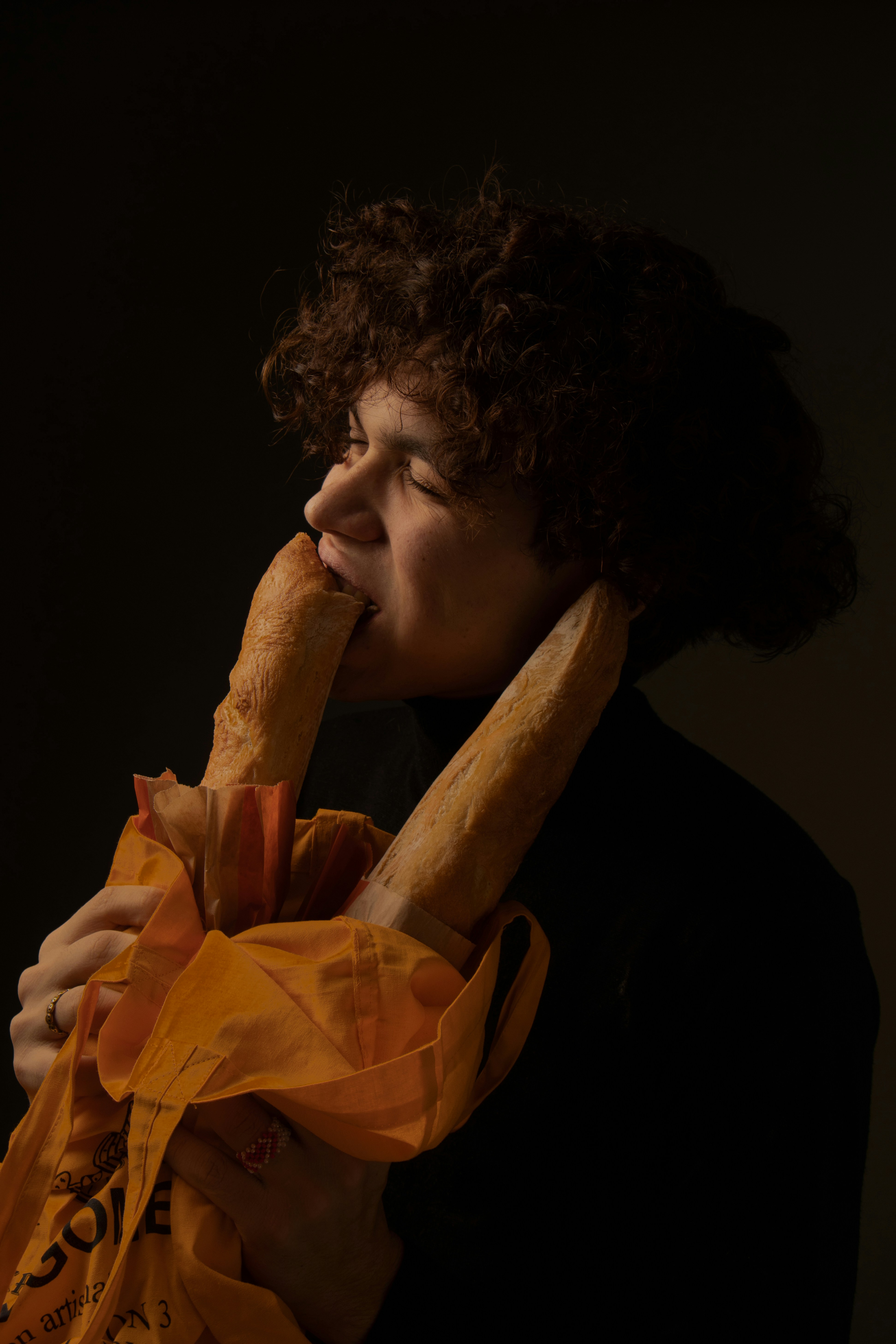 a man eating a bag of chips