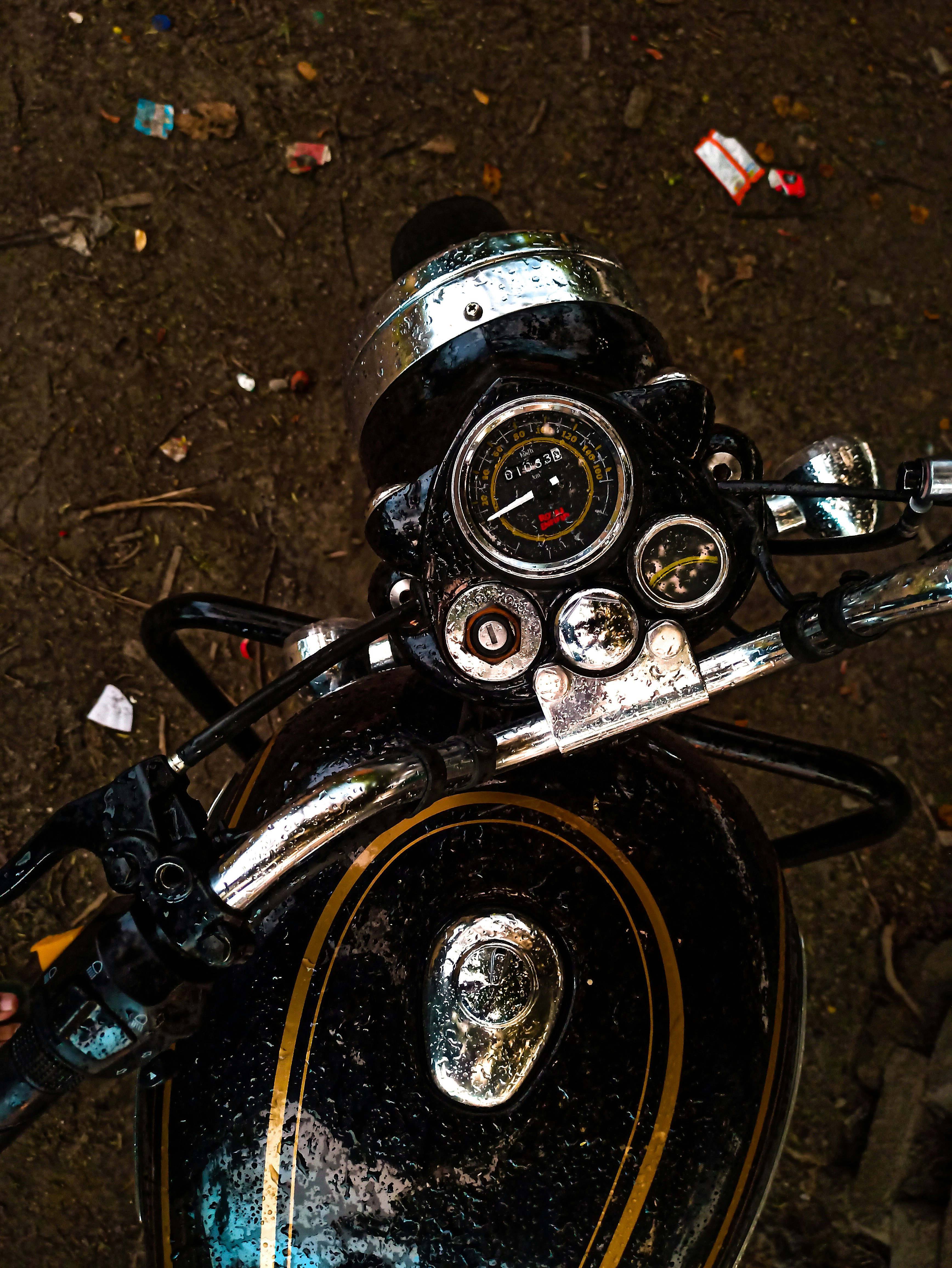Chrome and Dirt: A Top-Down Portrait of a Weathered Vintage Motorcycle Dashboard