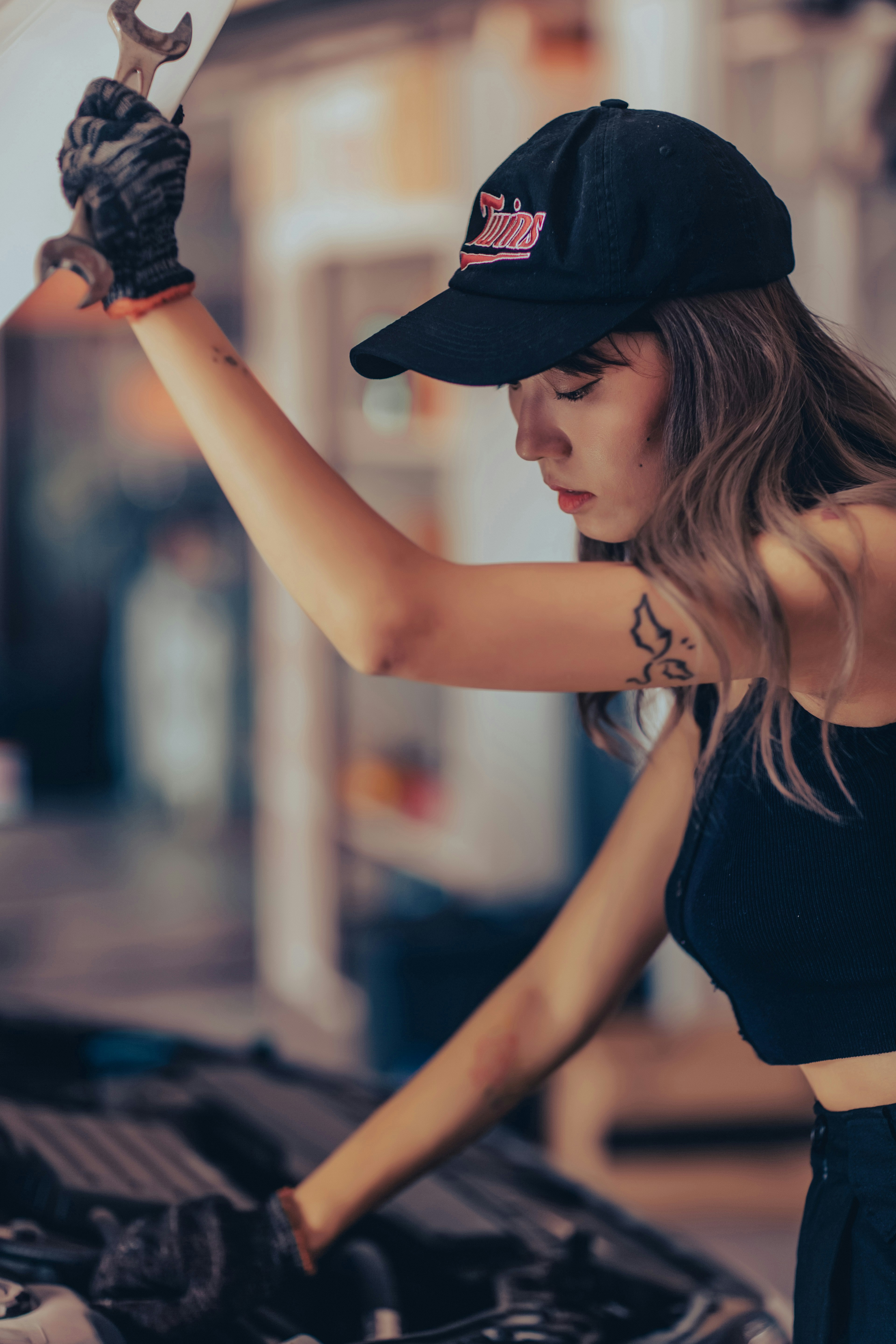 Cap-Wearing Technician at the Engine: a Moment of Focus