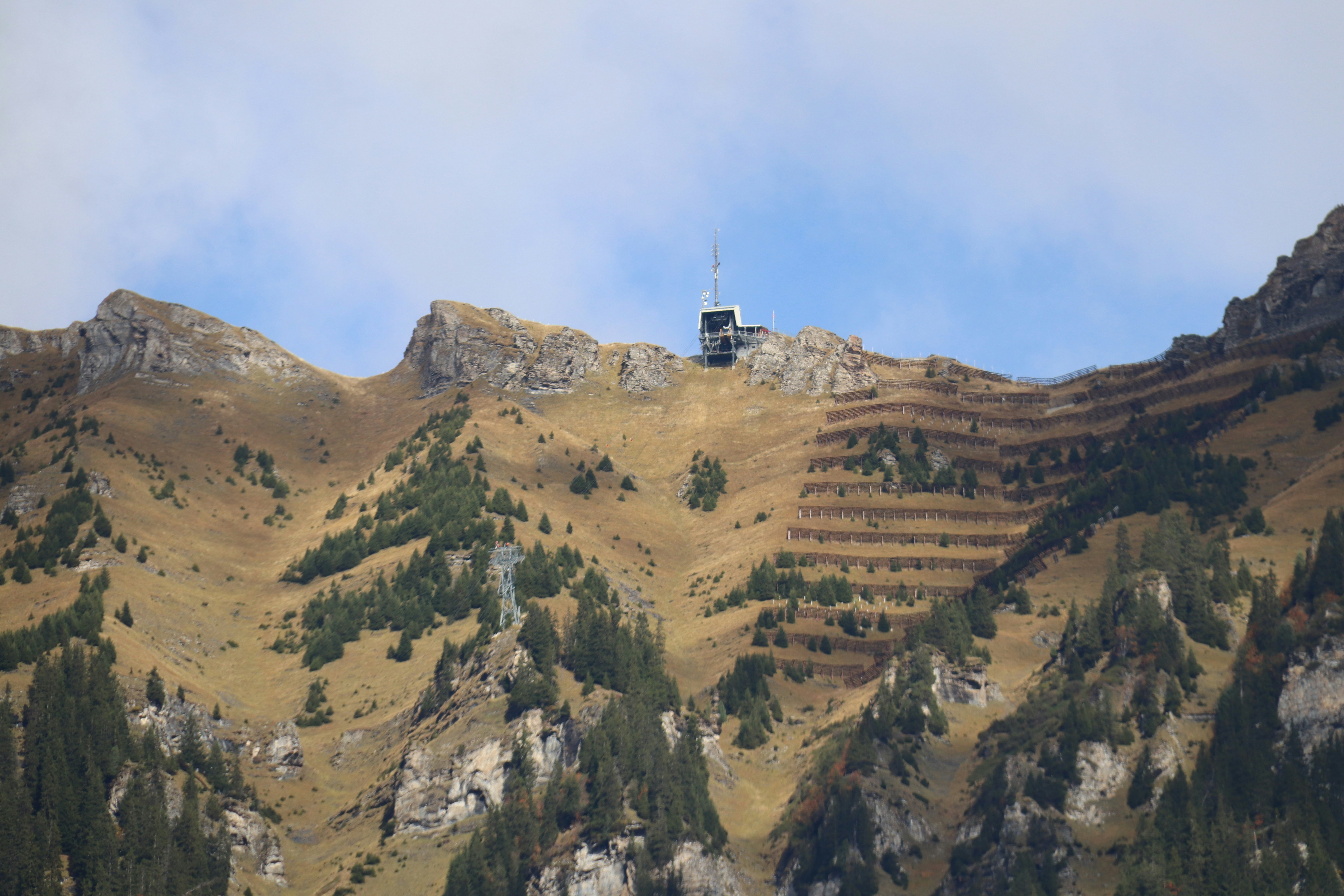 Tower on the Terrace: An Alpine Summit Crowned by a Lone Structure