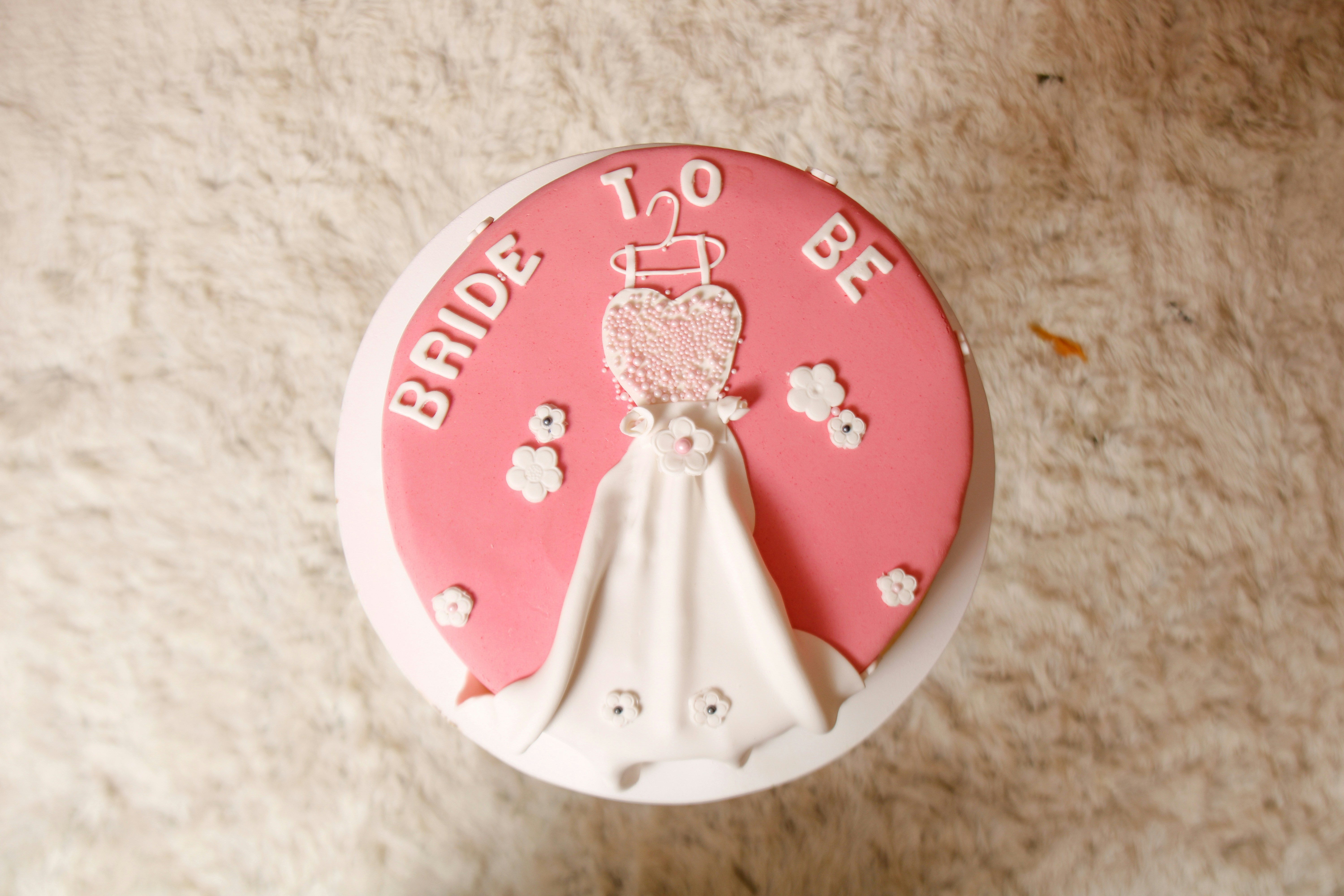 Bride-to-be Cake Top: Pink Fantasy Keepsake on Textured Table
