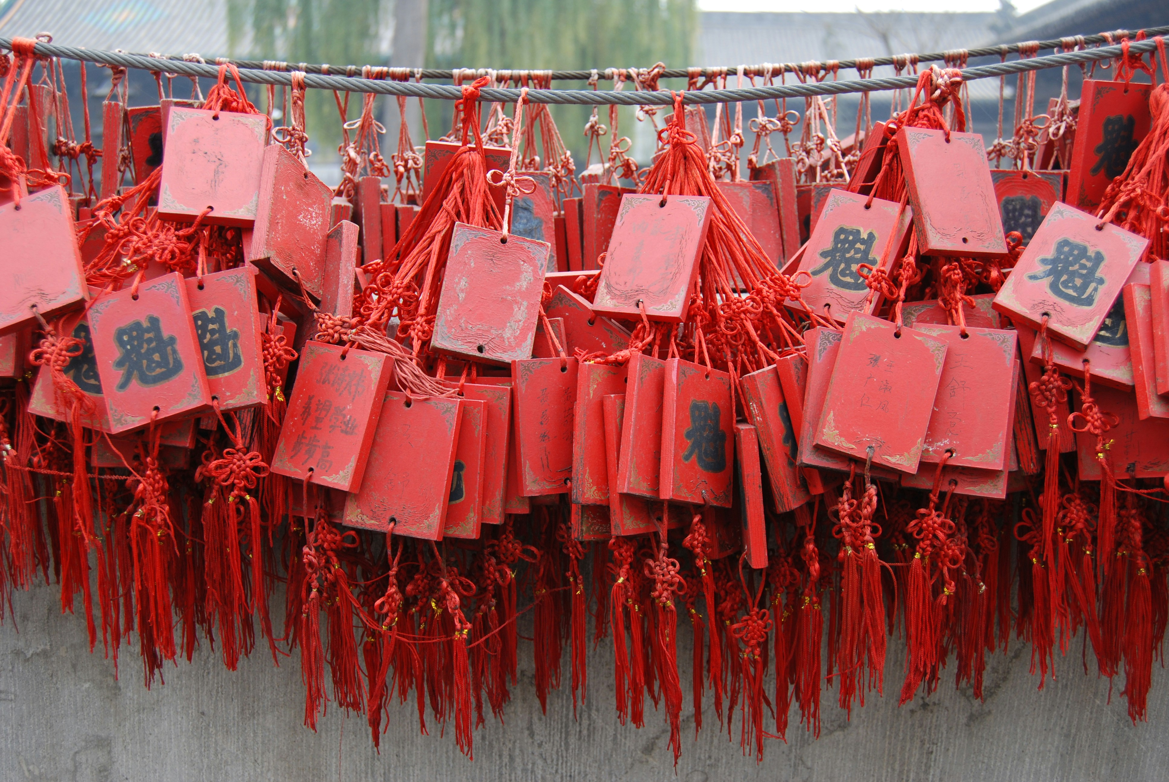 A group of red and white stringed objects photo – Free Construction ...