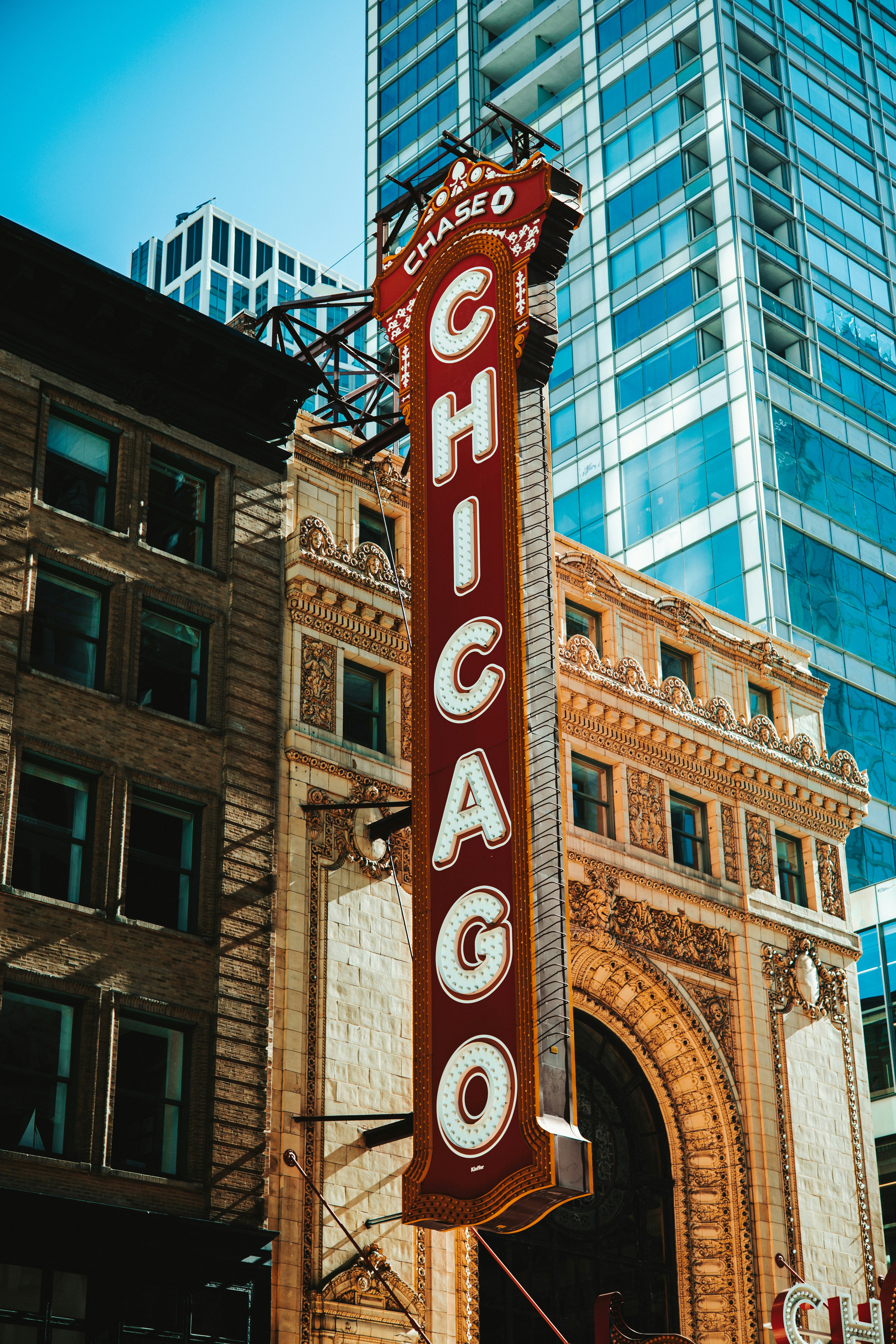 A large red sign in front of a building photo – Free Wallpaper Image on ...