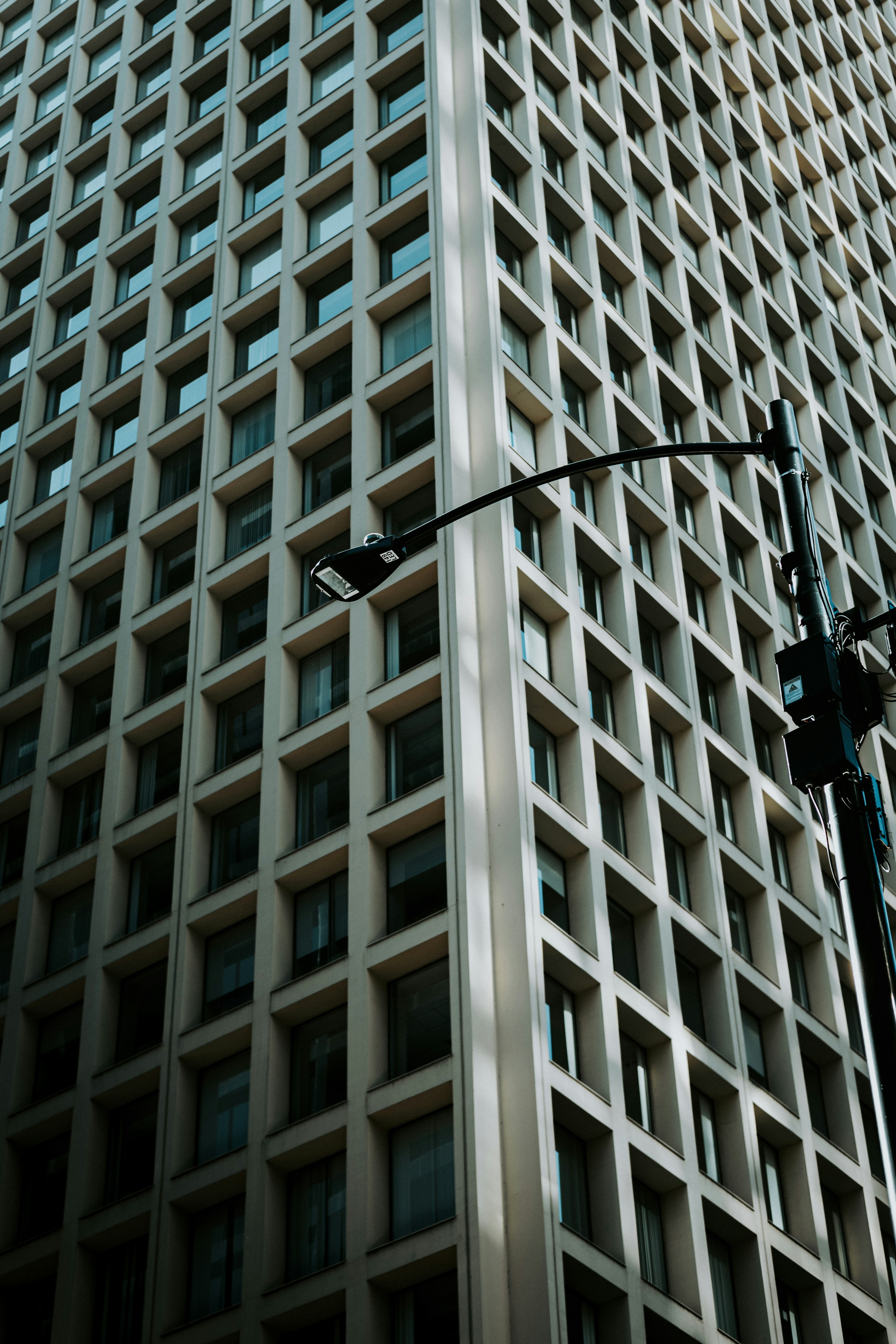 a tall building with a street light