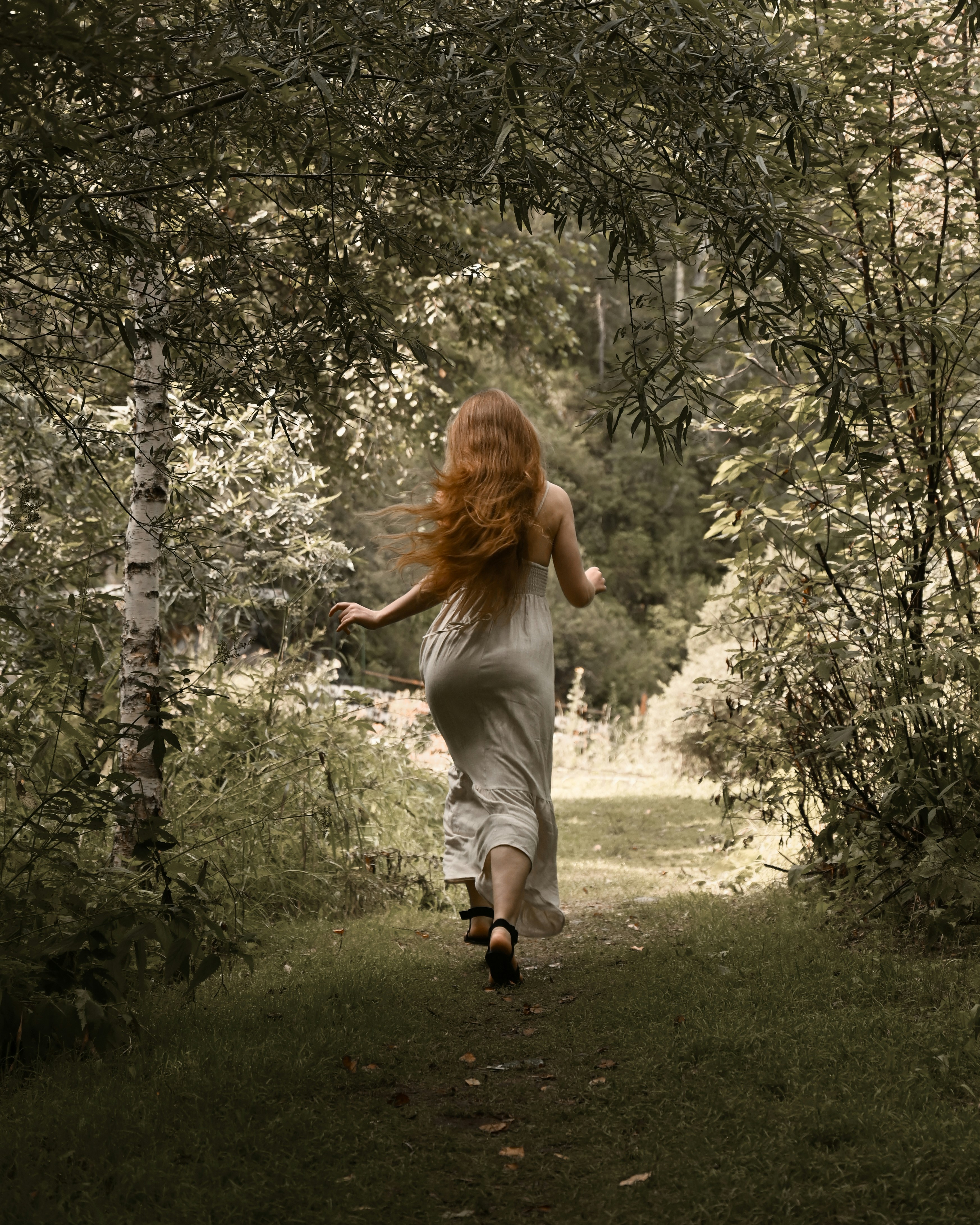 Girl Running Away Scared In Forest