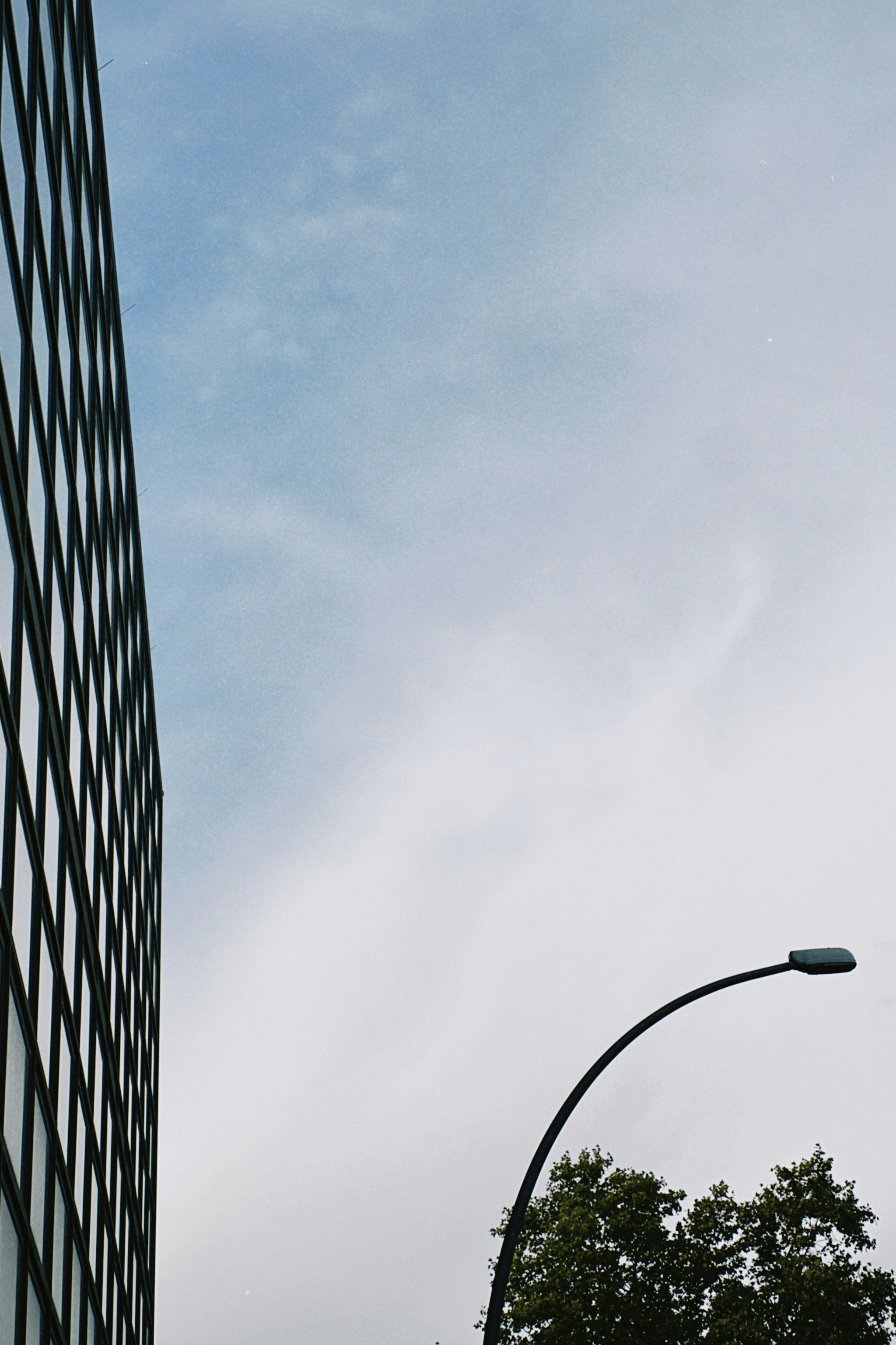 A tall building with a street light photo – Free Berlin Image on Unsplash