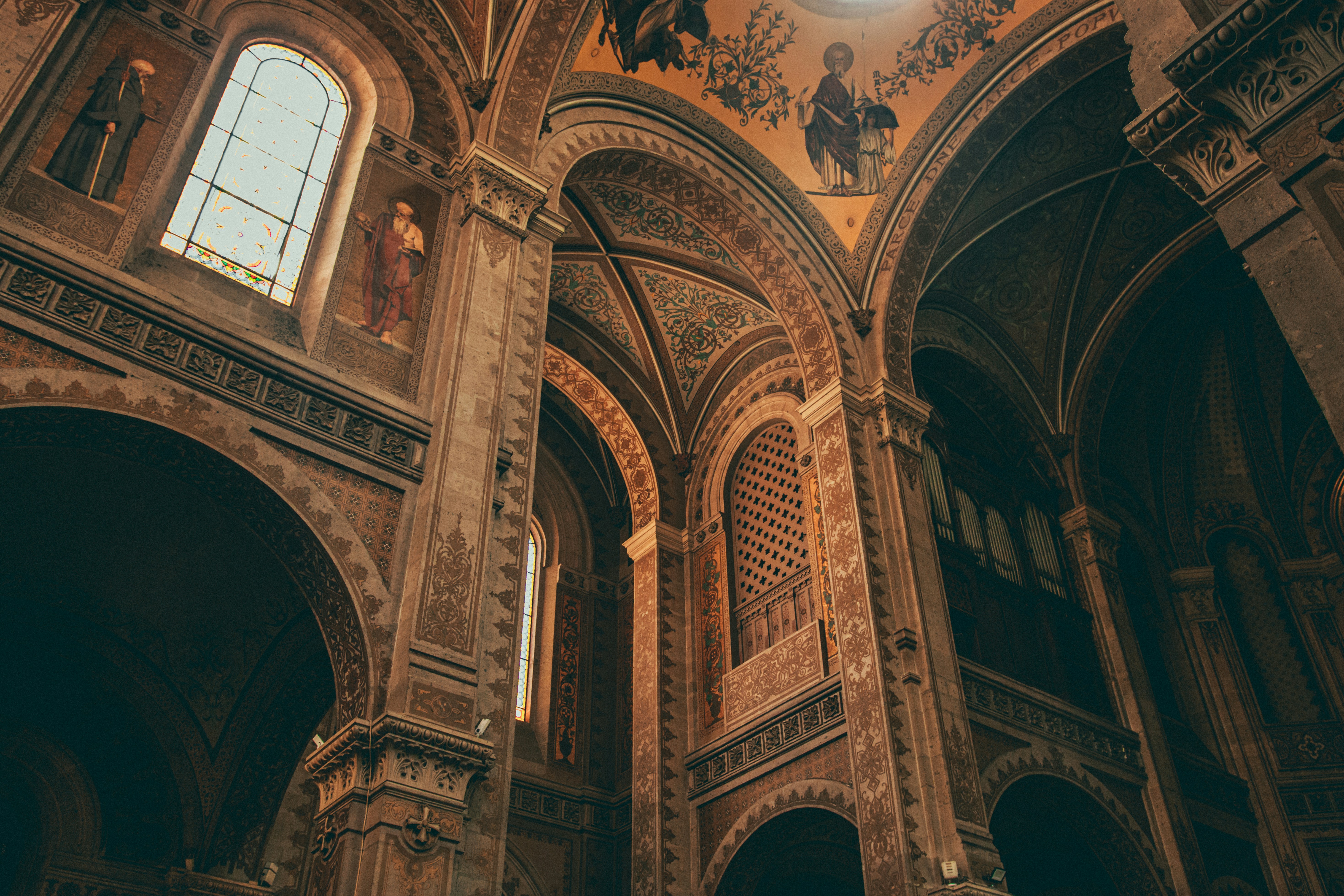 A large ornate building with arched windows photo – Free Ciudad de ...