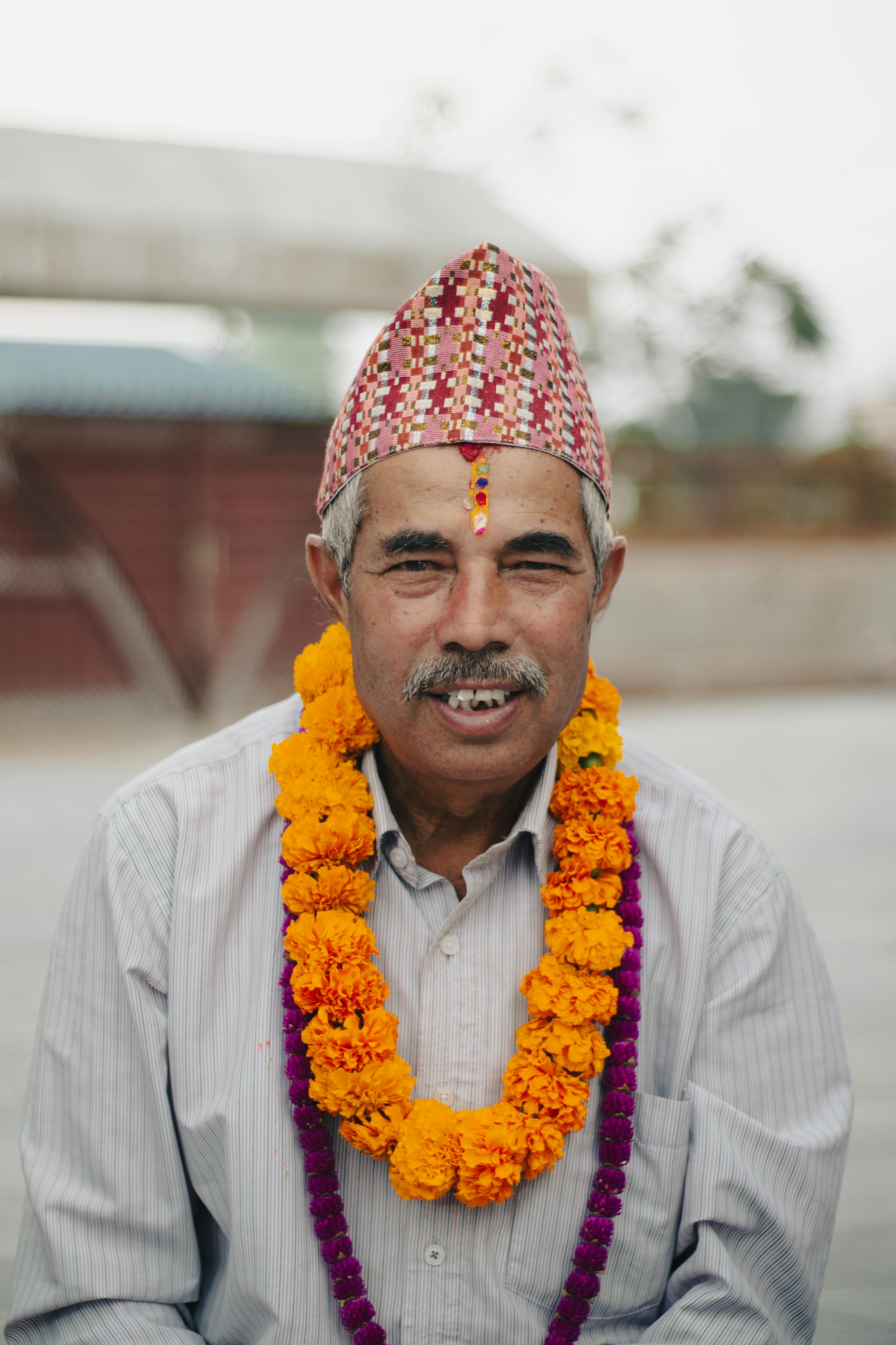 a man wearing a colorful headdress