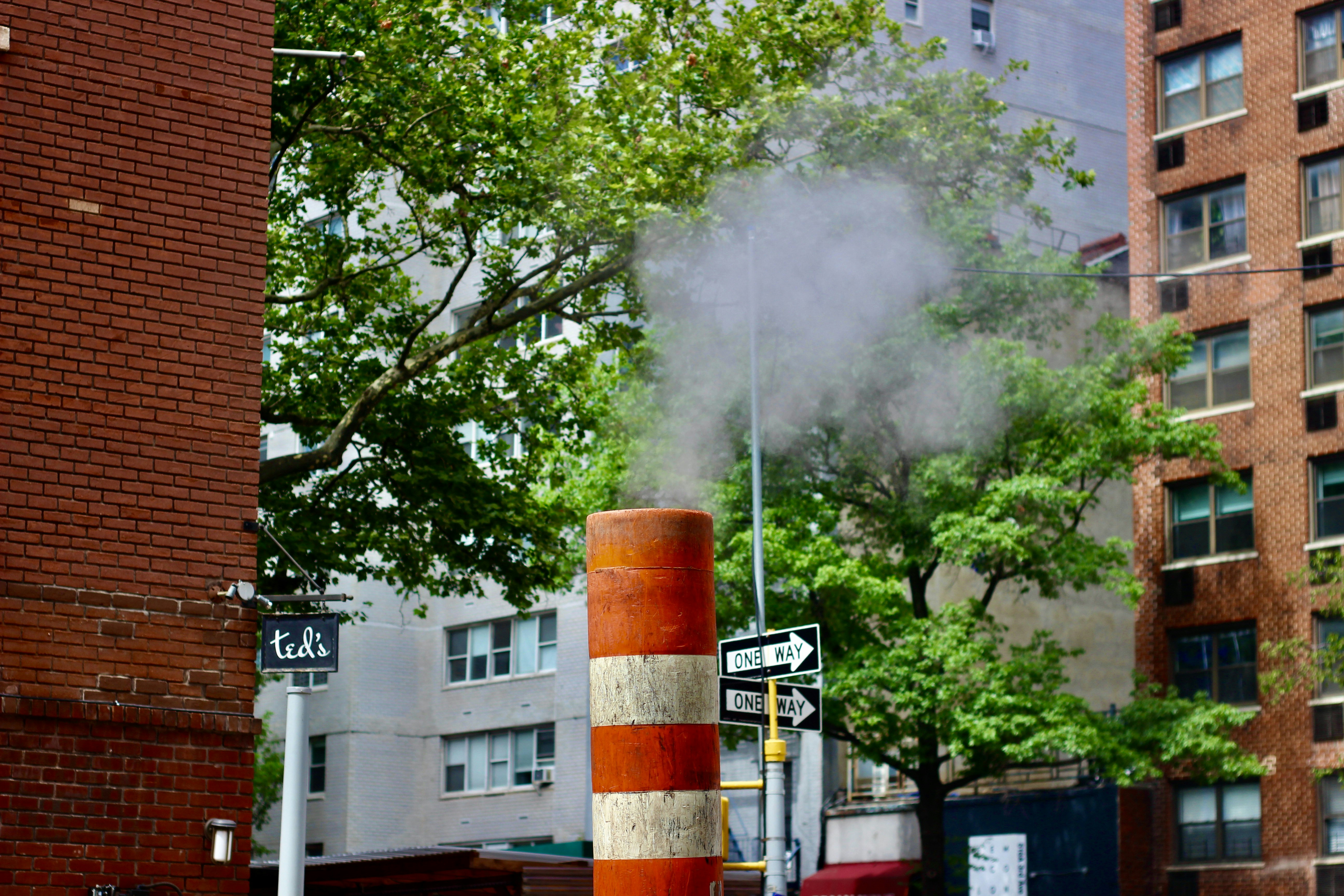 Steam Rising from a Barrier: Urban Quiet with a Smoky Pulse