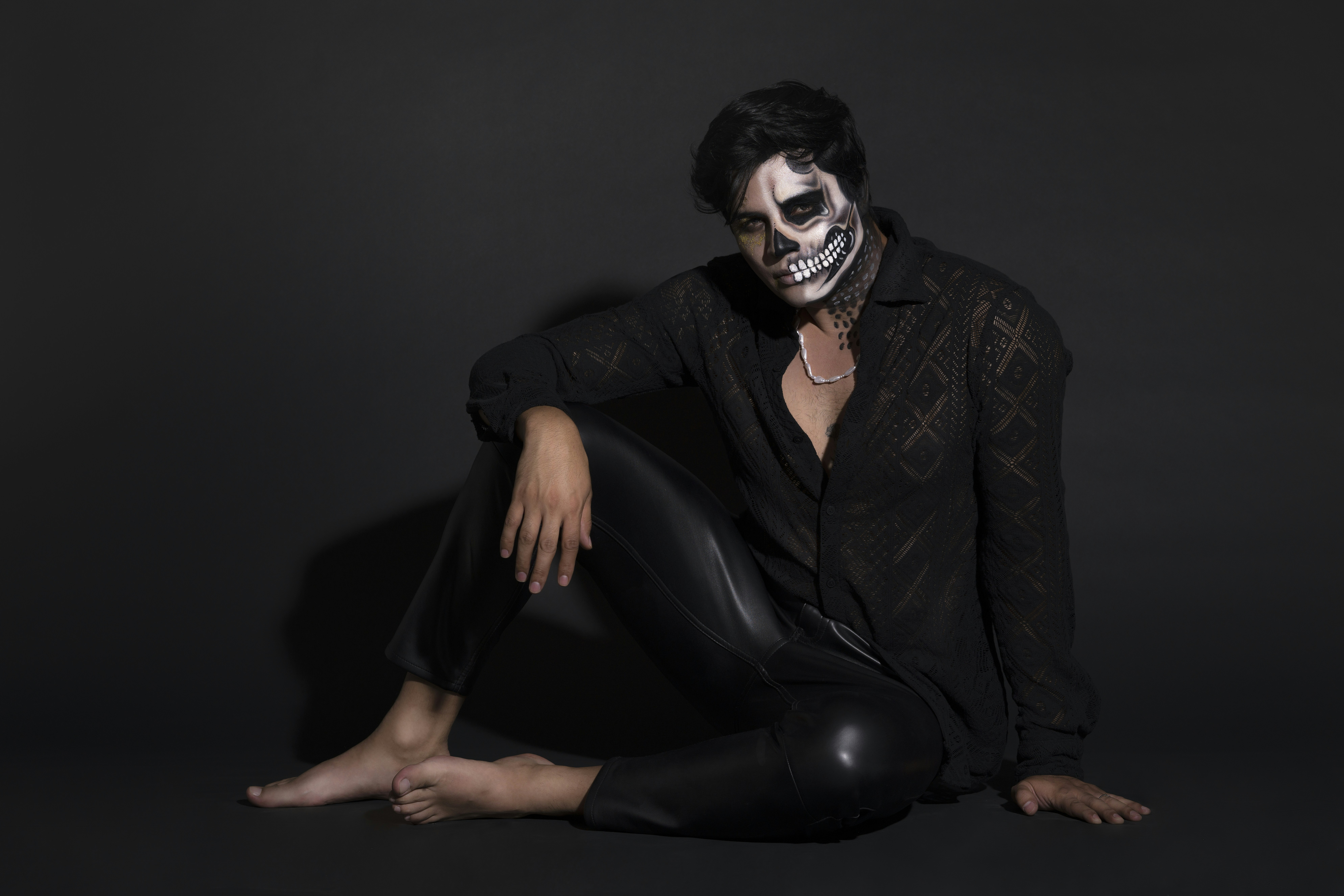 Midnight Masquerade: A Skeletal Smile Amid Velvet Shadows