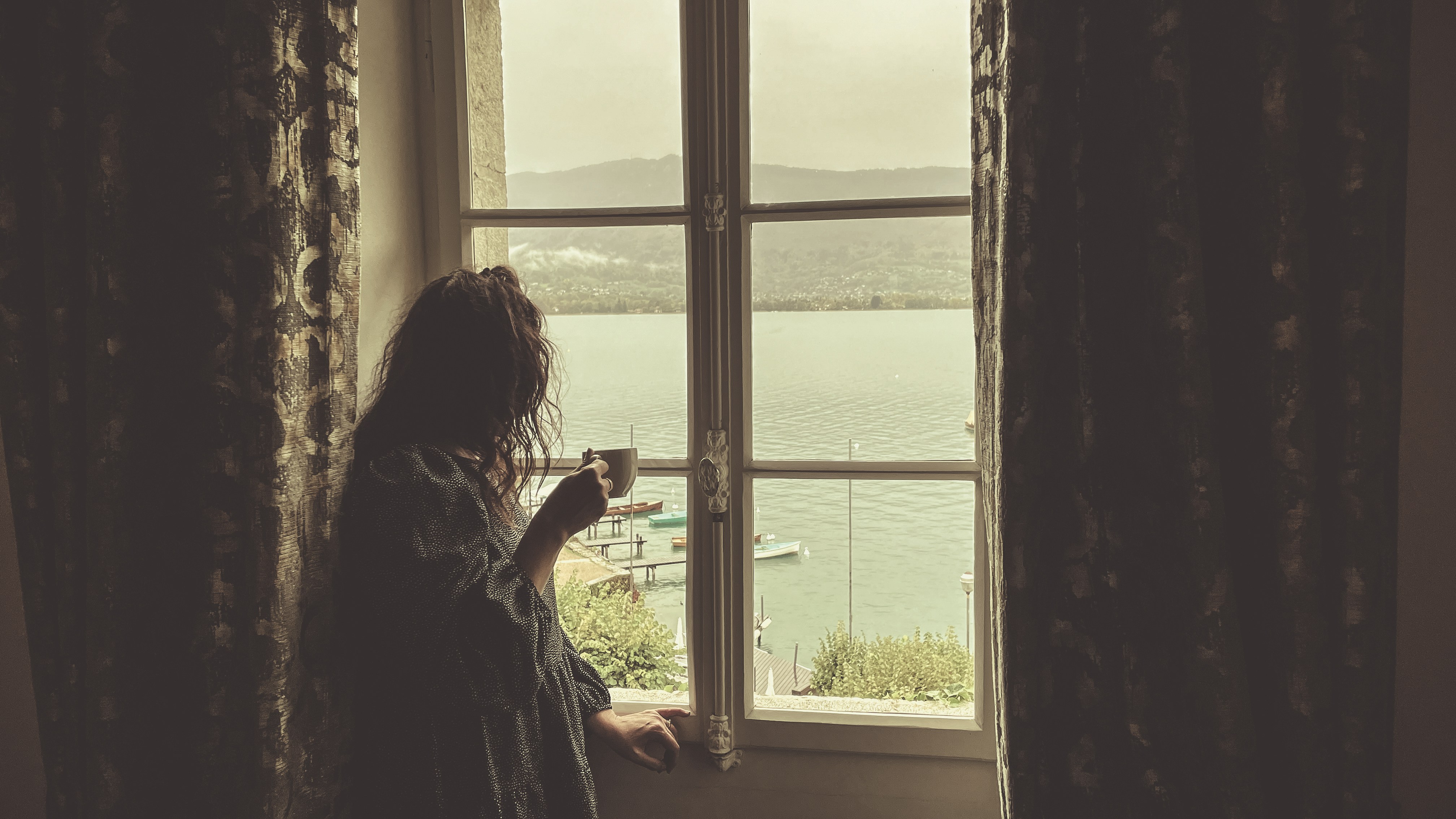 A person looking out a window photo – Free Think Image on Unsplash