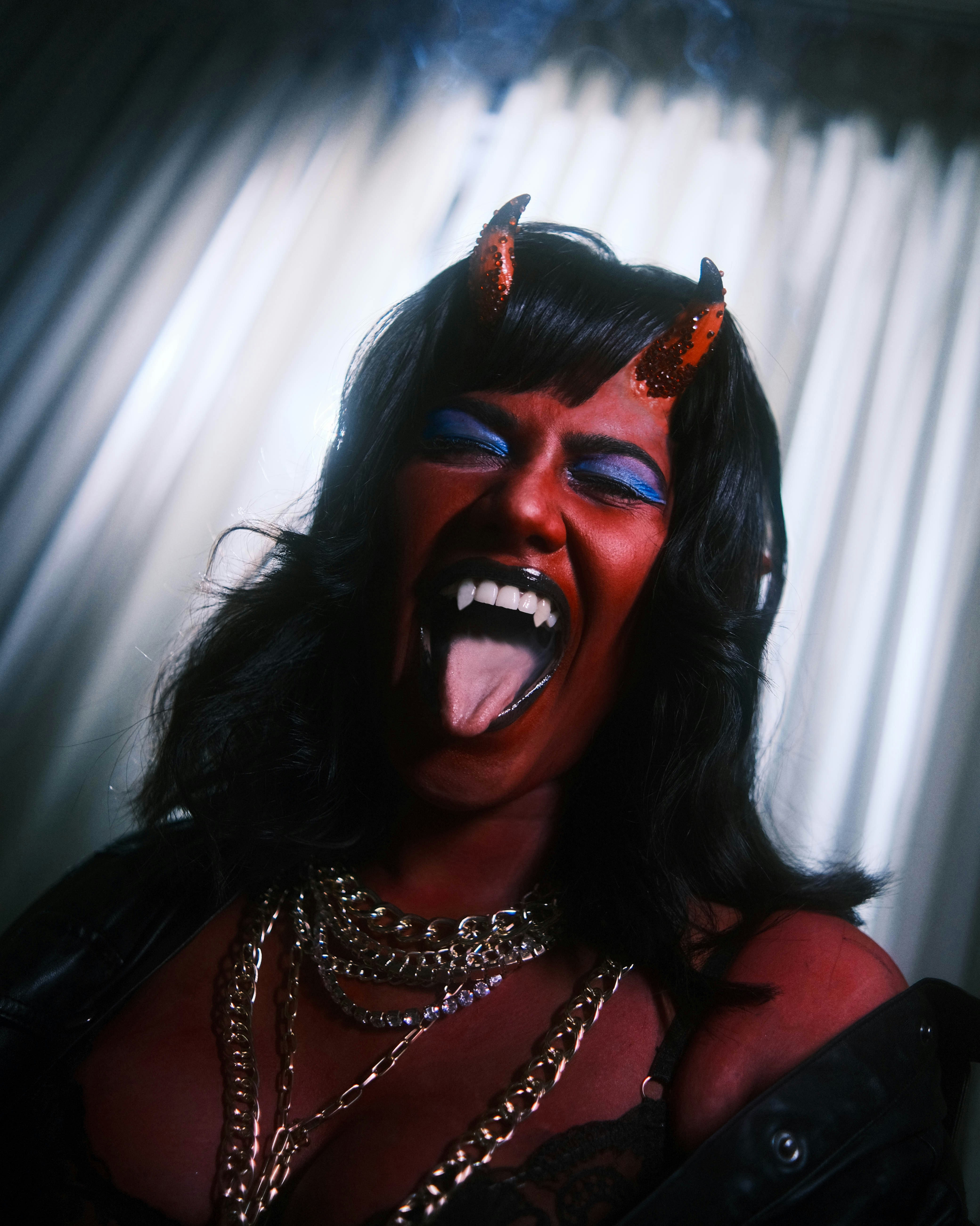 Devilishly Expressive: A Bold Portrait with Fiery Hue and Tongue-out Attitude
