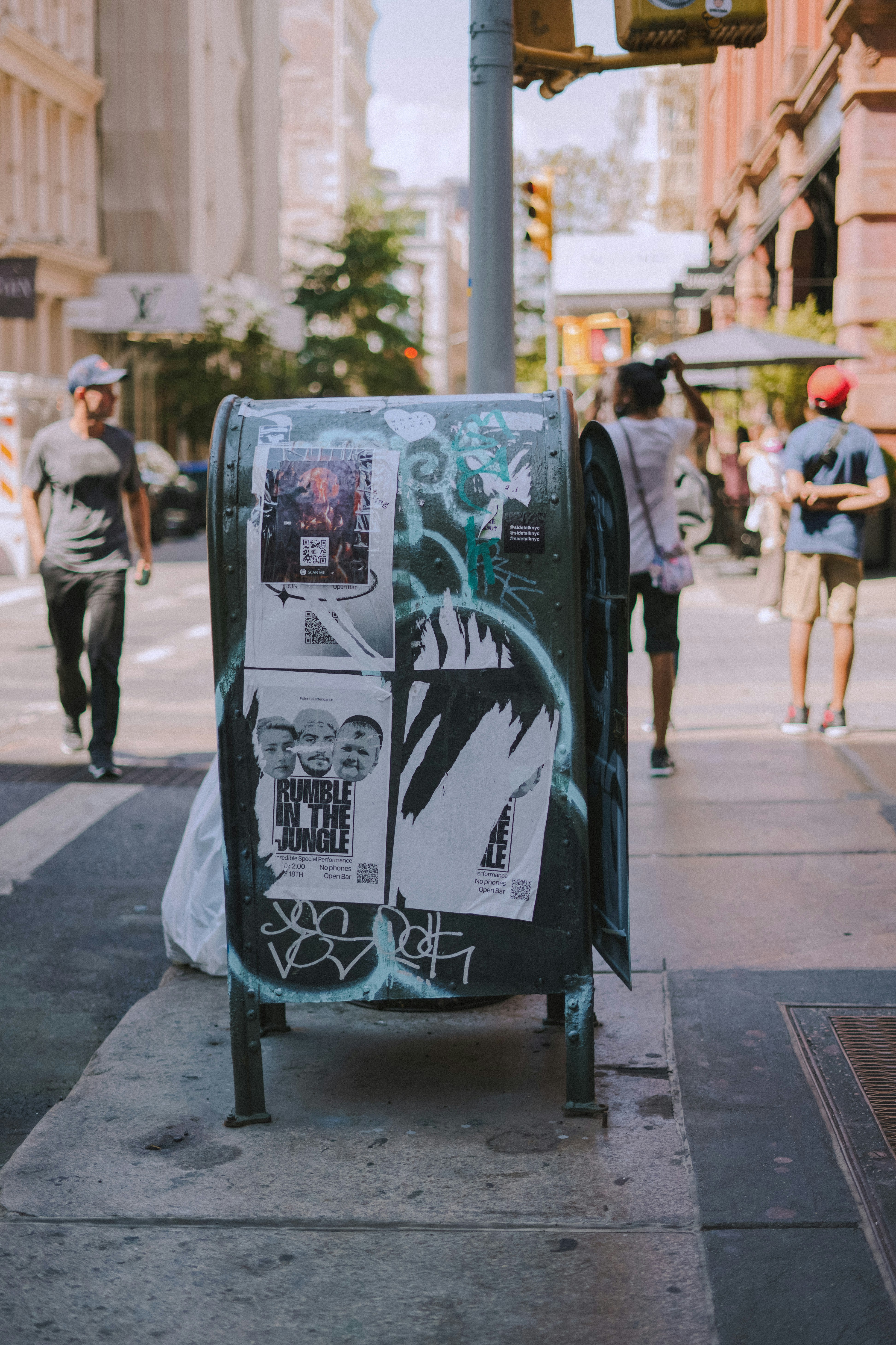 Concrete Canvas: A Graffiti-Streaked Mailbox Anchoring a City Crosswalk