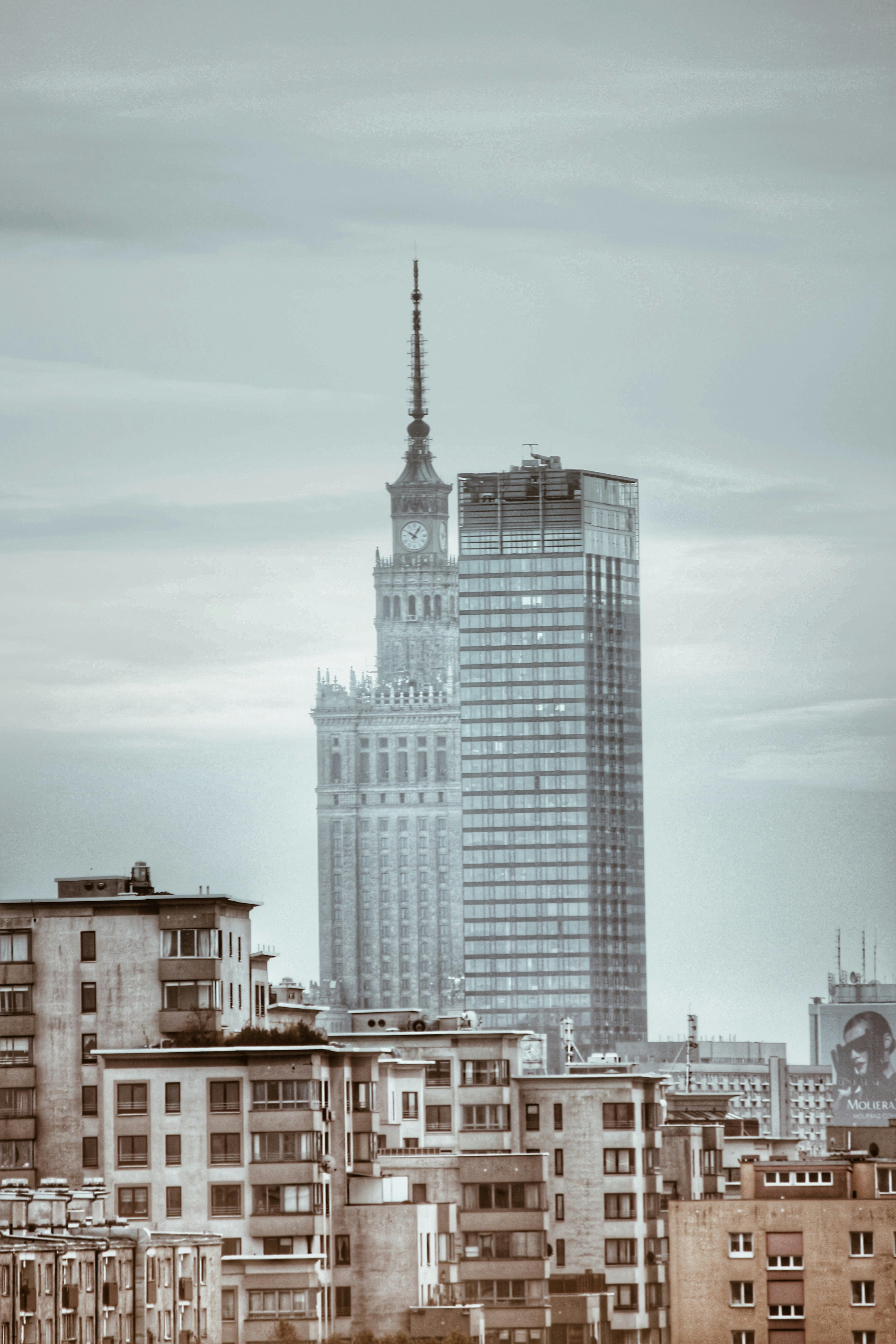 A large building towers over a city photo – Free City Image on Unsplash