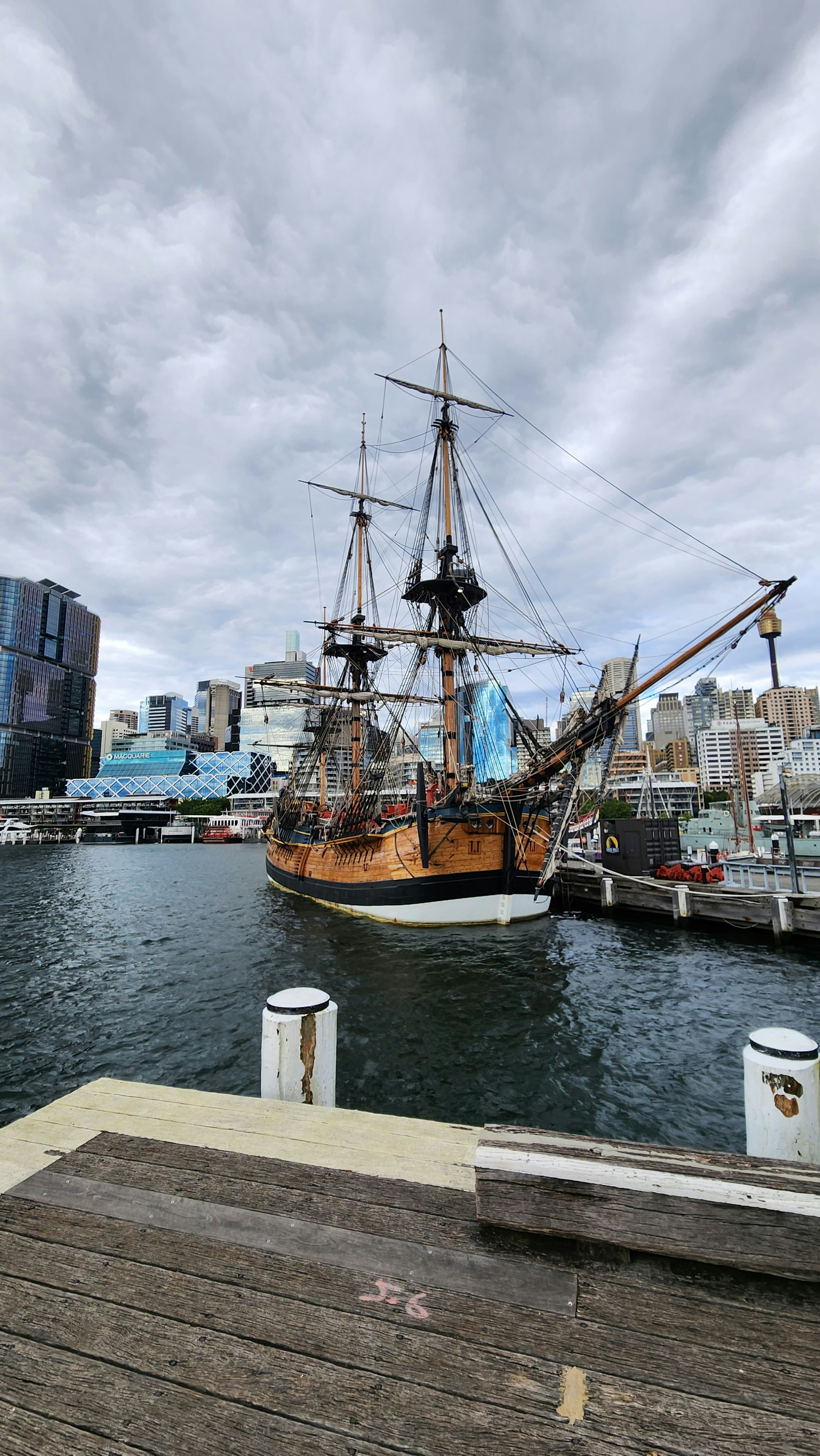 Timber Rigged Voyager at the Nexus of Harbor and Skyline