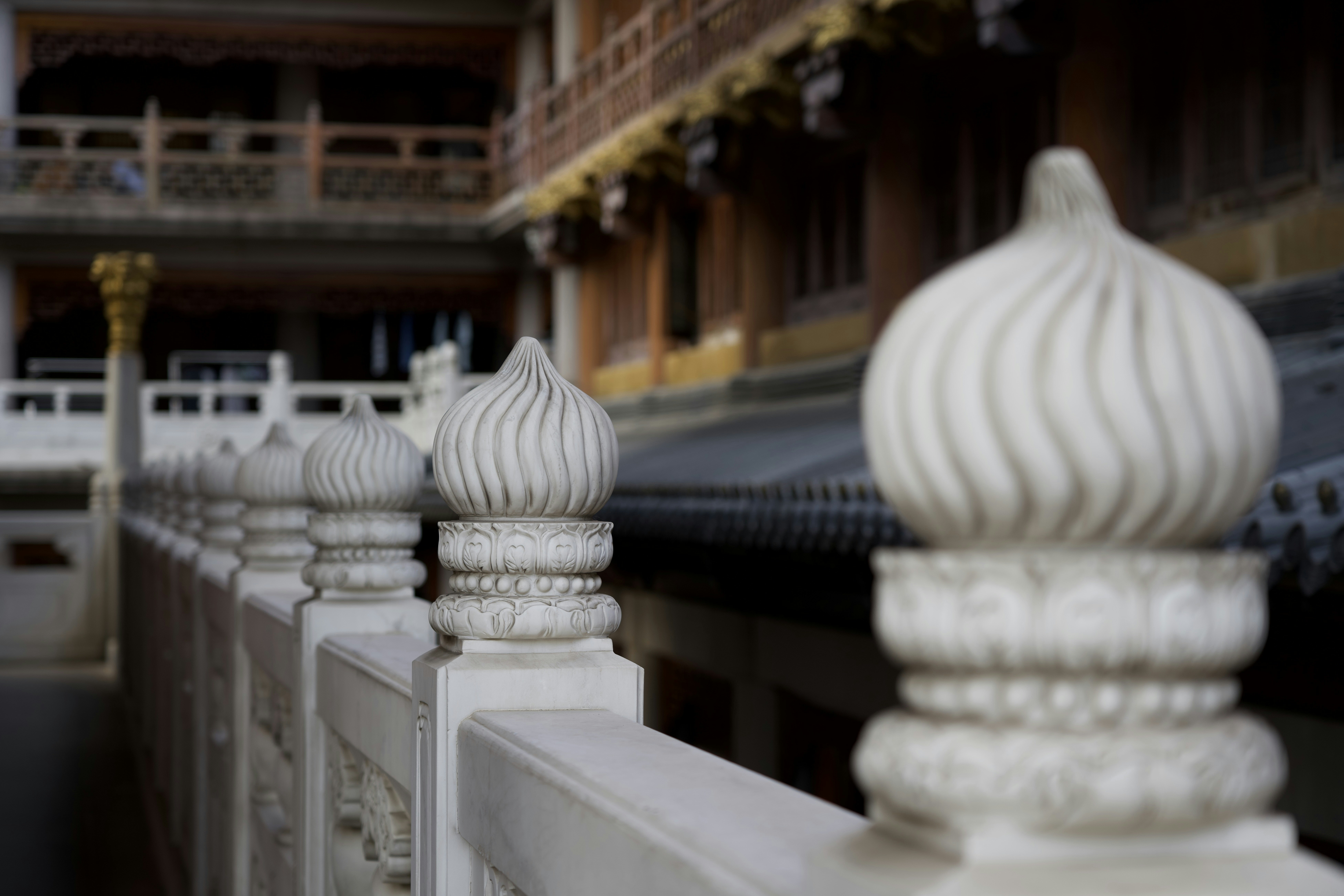 Whispering White Balusters: Receding Geometry Along a Temple Courtyard