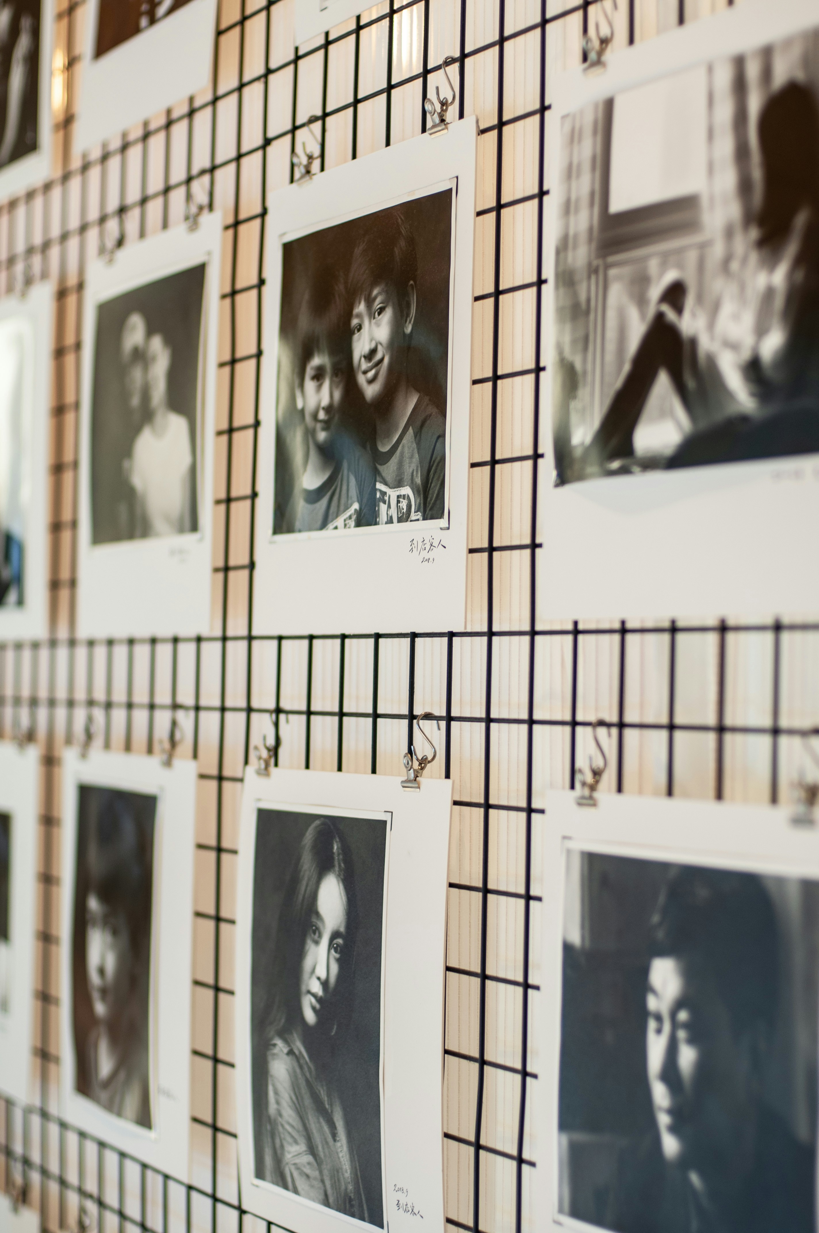 Two Friends in Focus: A Central Polaroid Anchoring a Grid of Portraits