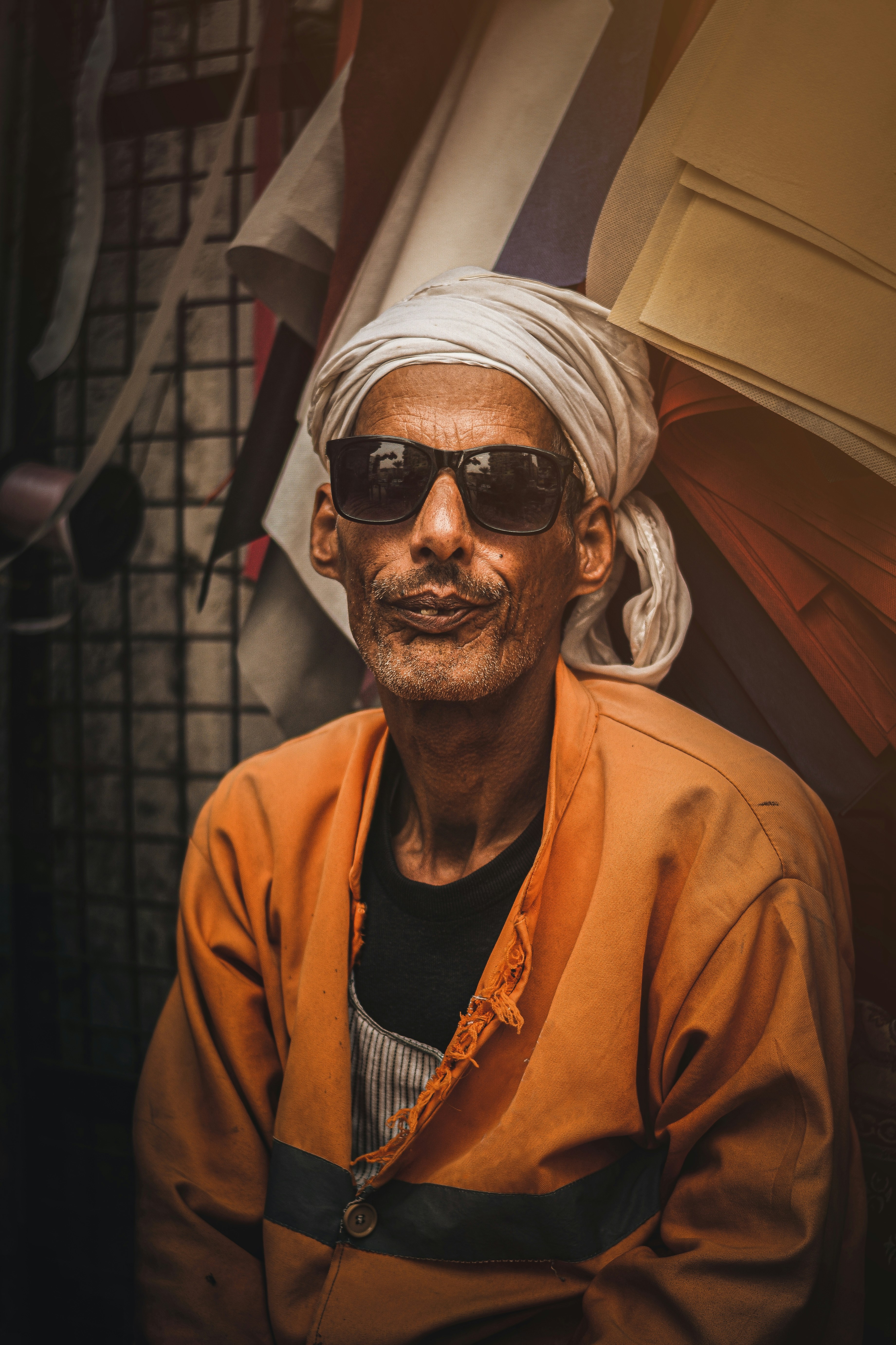 Sunlit Sage: A Sunglassed Stranger in Warm Tones